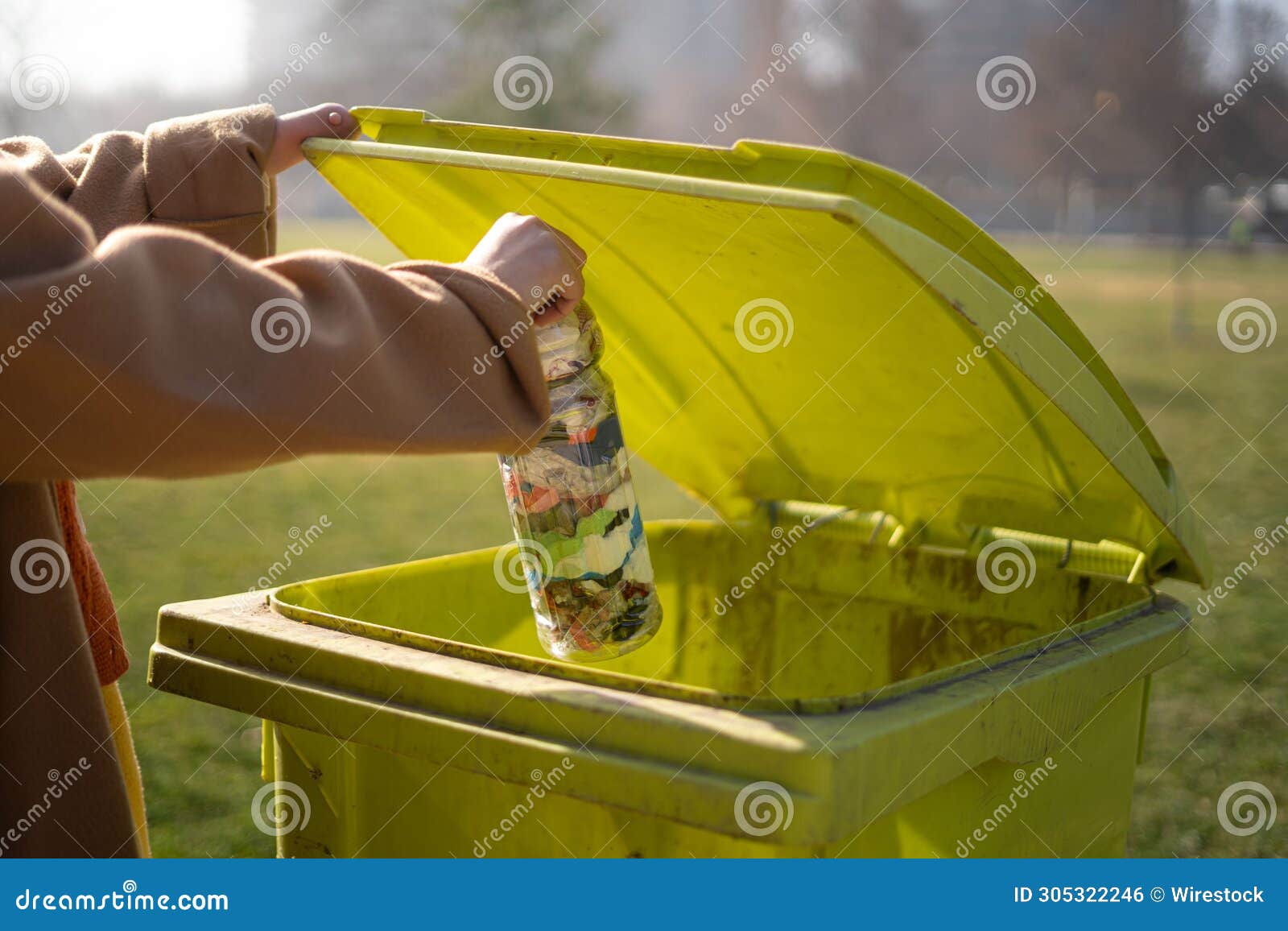 Woman with Disability in Hand Throwing a Plastic Bottle into Green ...