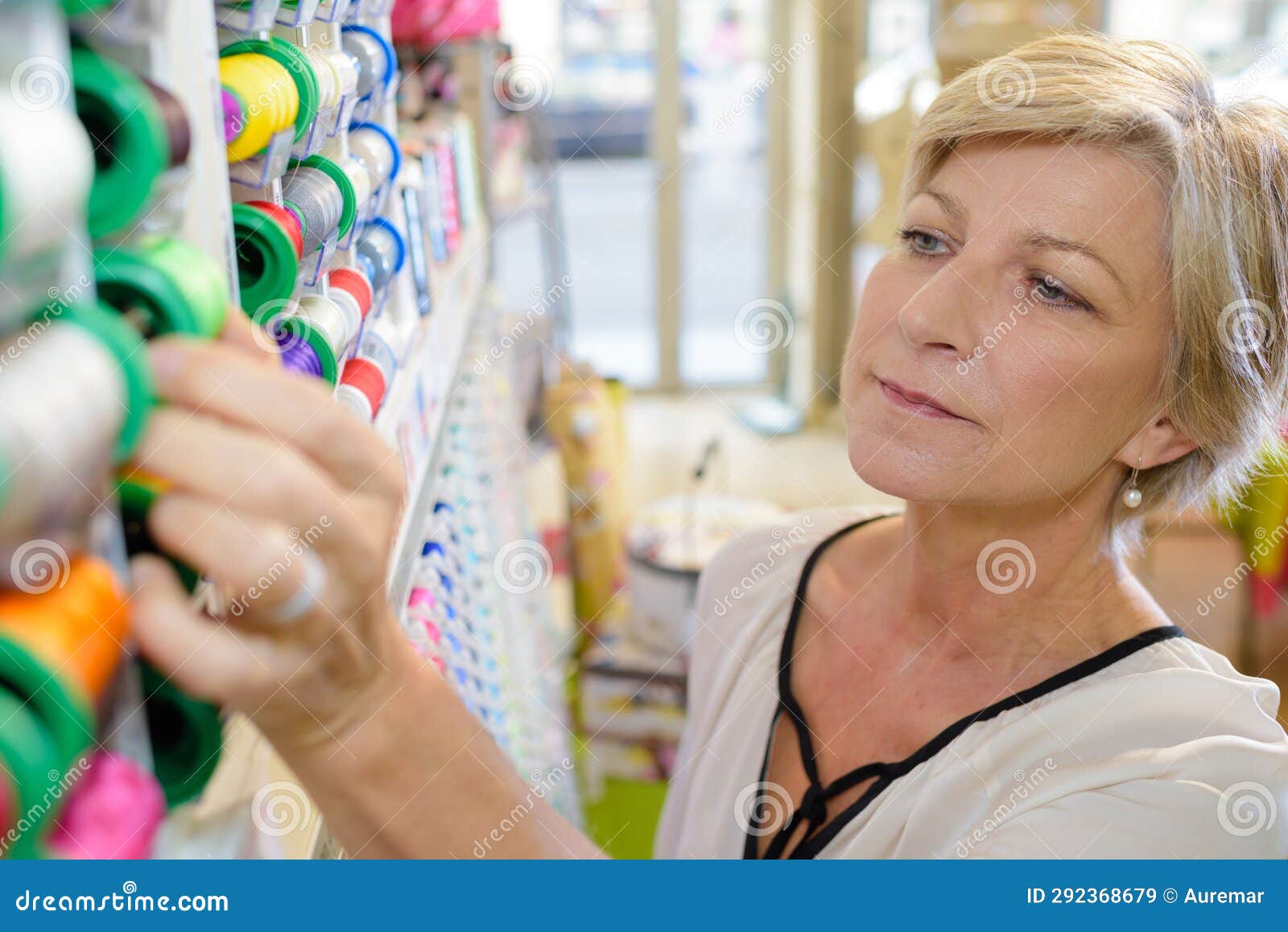 Woman and display threads stock image. Image of tailor - 292368679