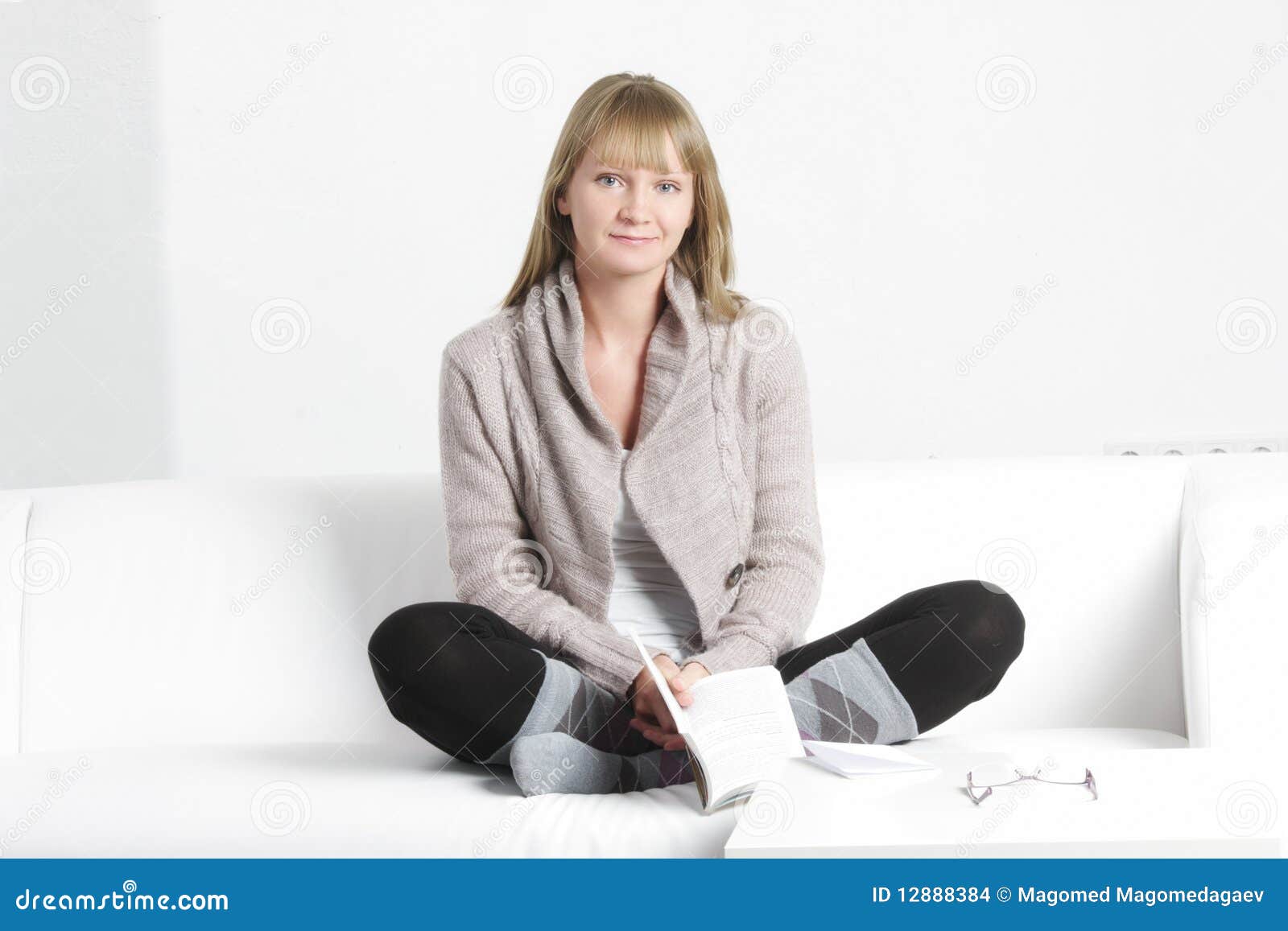 Woman Distracted from Reading Stock Photo - Image of crossed, table ...