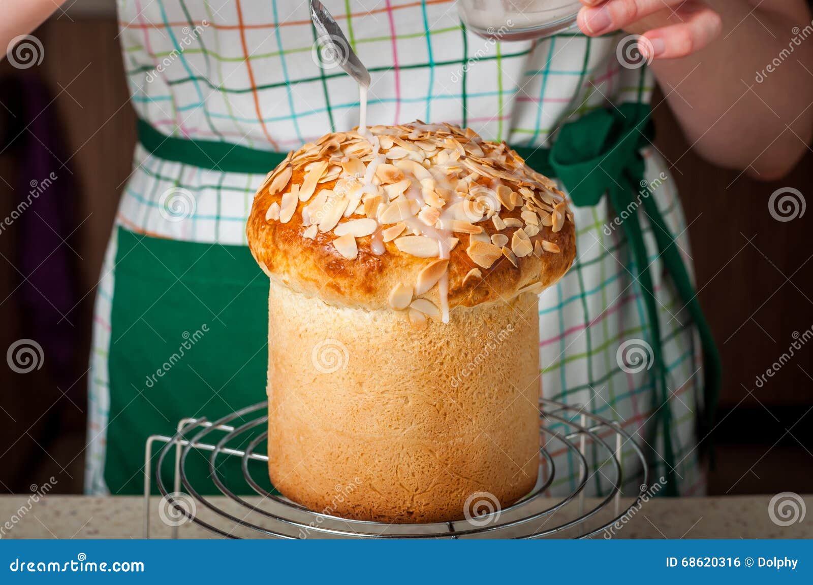 A Woman Dizzling Easter Bread with Sugar Icing Stock Photo - Image of ...