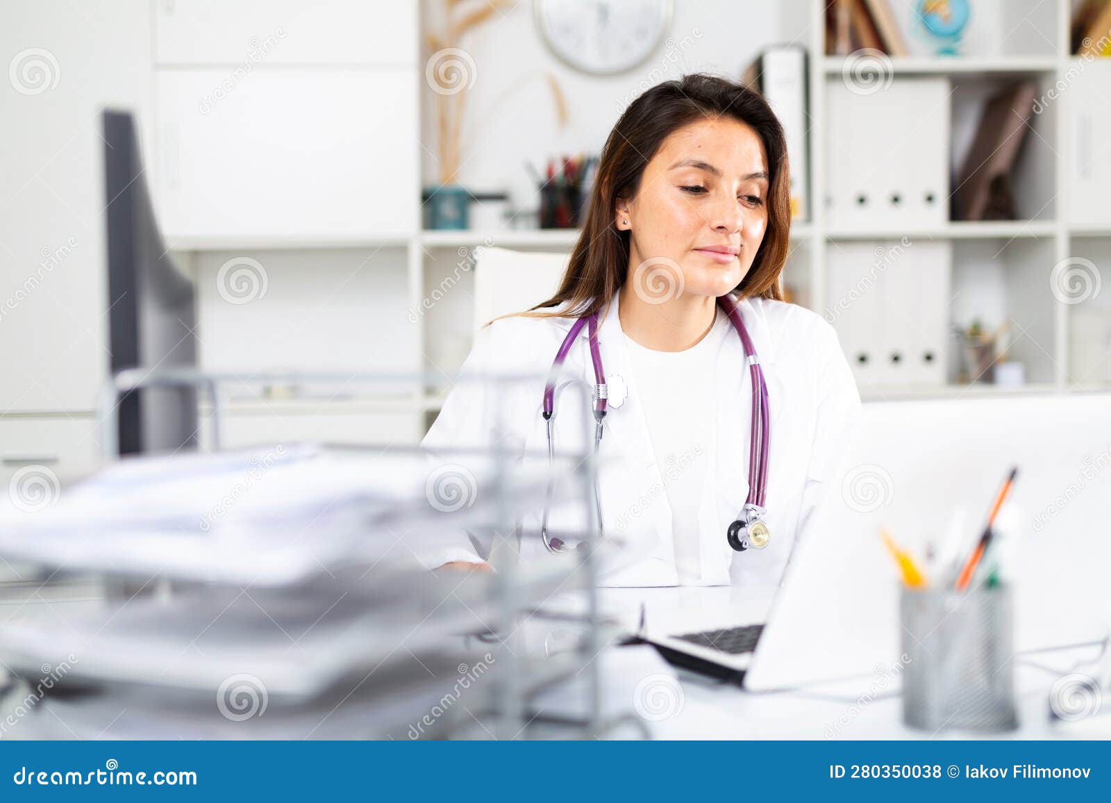 Woman Doctor Sitting at Workplace with Computer in Office Stock Photo ...