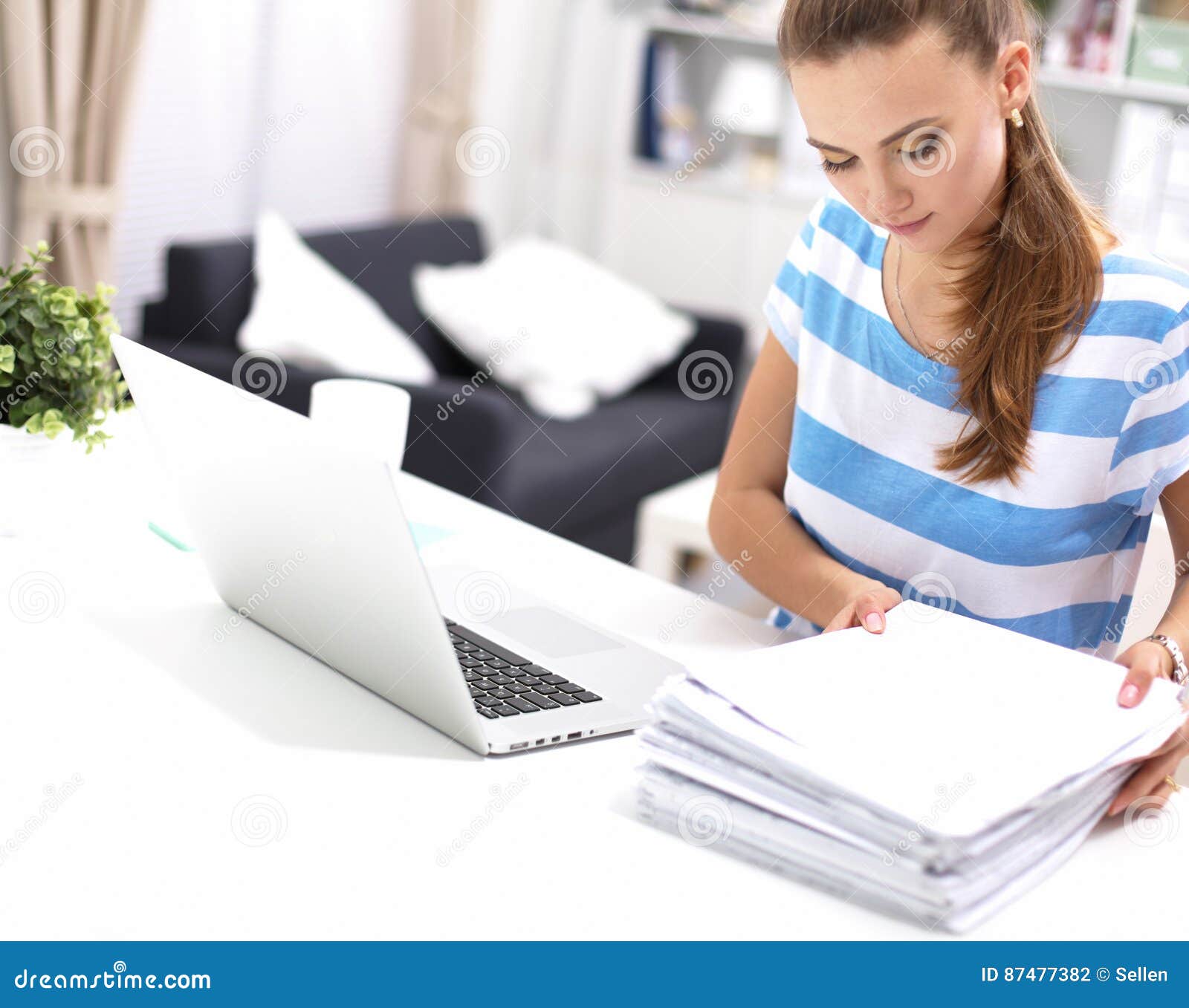 Woman with Documents Sitting on the Desk and Laptop Stock Photo - Image ...