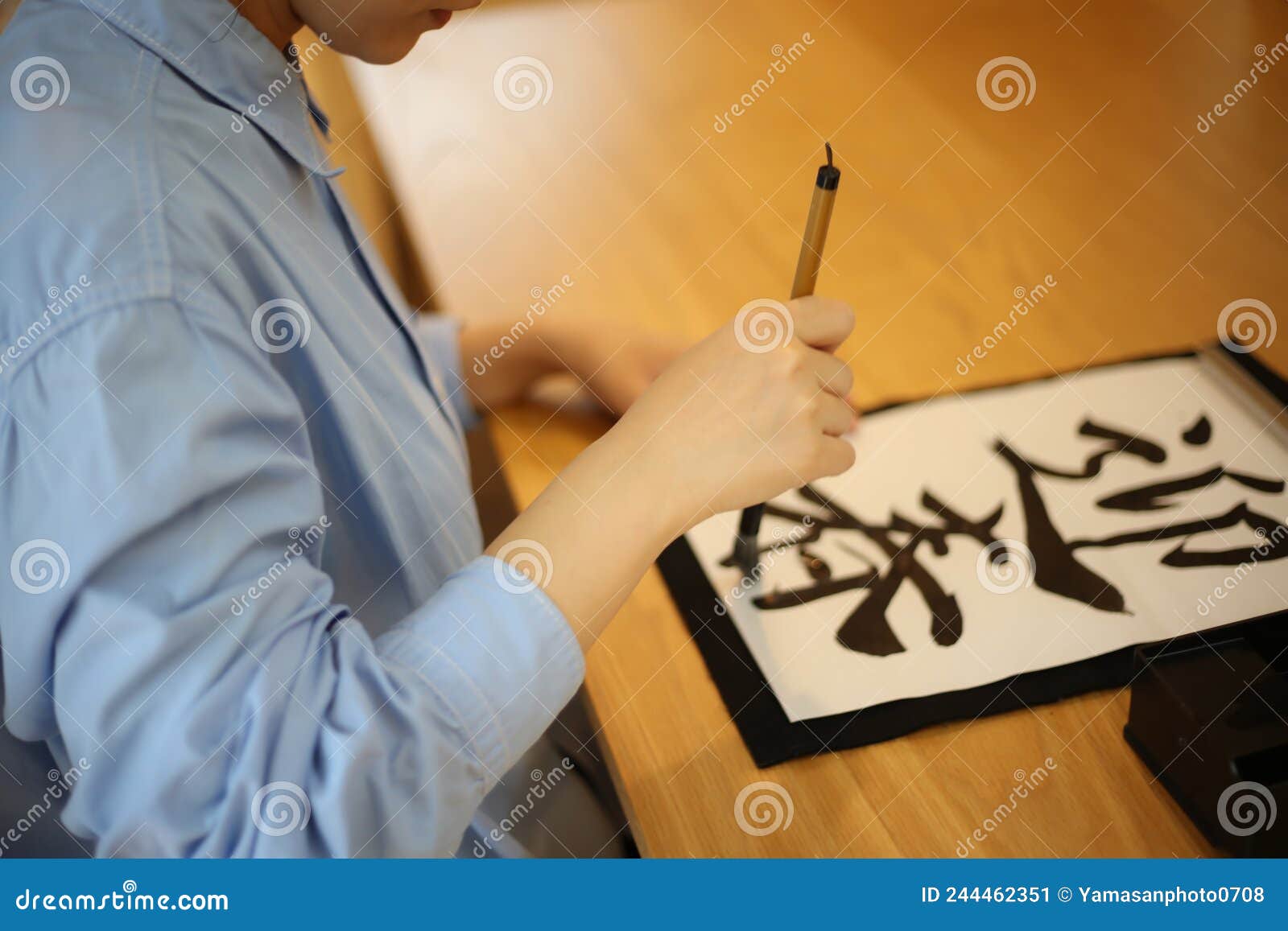 Woman doing calligraphy stock image. Image of calligraphy - 244462351