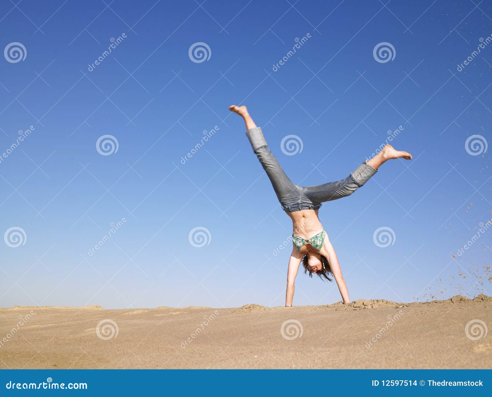 Woman Doing Cartwheel stock photo. Image of camera, copy - 12597514