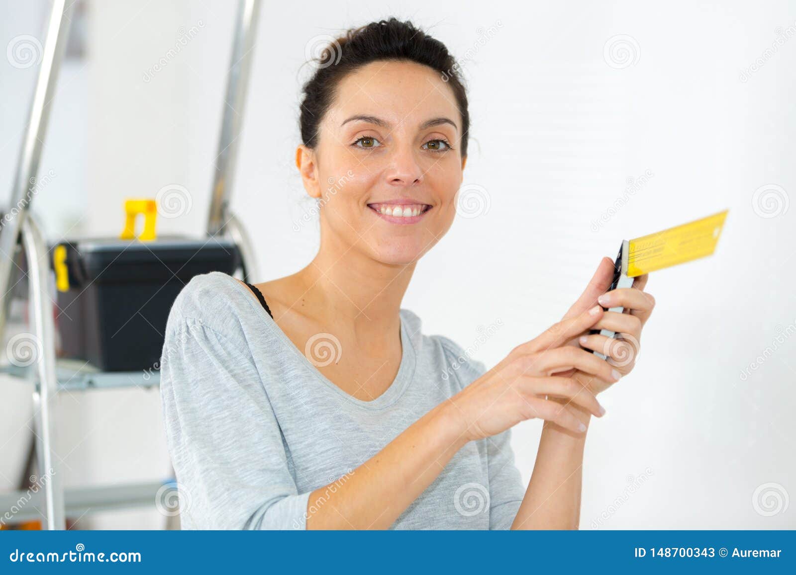 Woman doing diy at home stock image. Image of smiling - 148700343