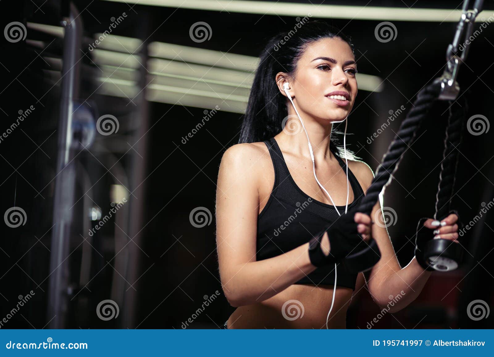 Woman Doing Exercise at Crossover Machine in Gym Stock Image - Image of ...