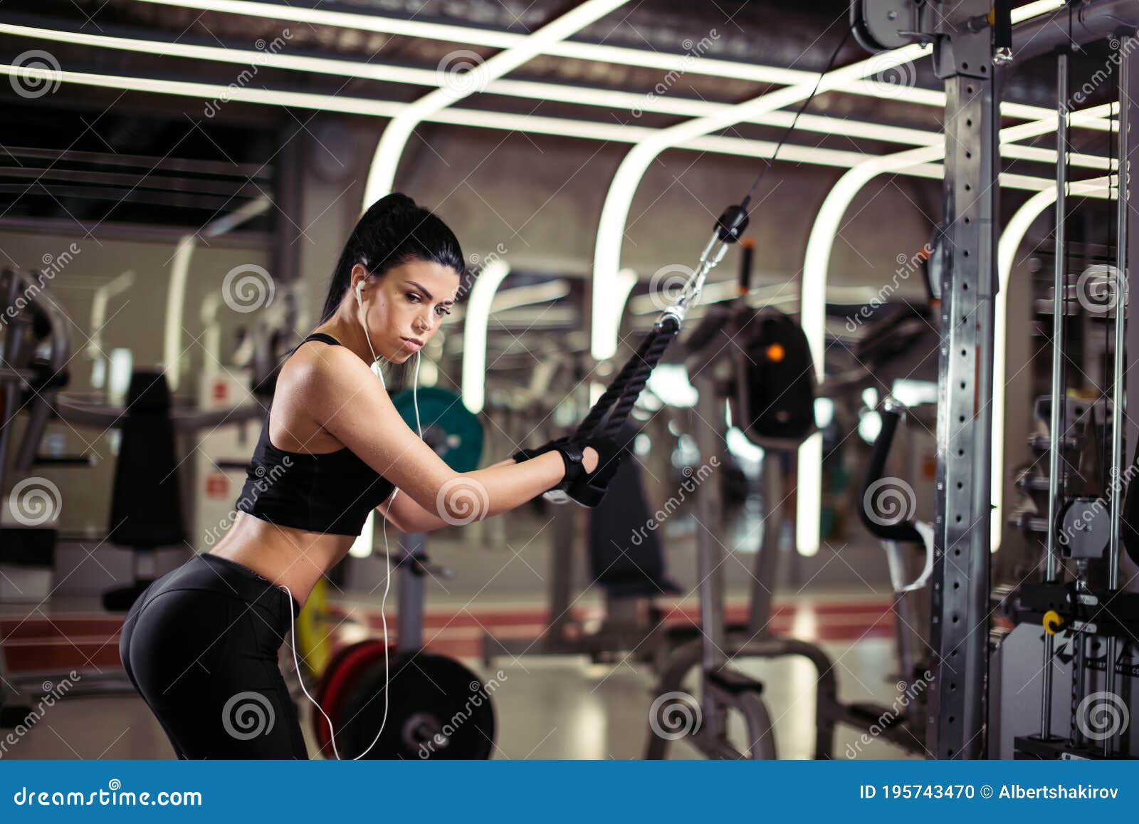 Woman Doing Exercise at Crossover Machine in Gym Stock Photo - Image of ...