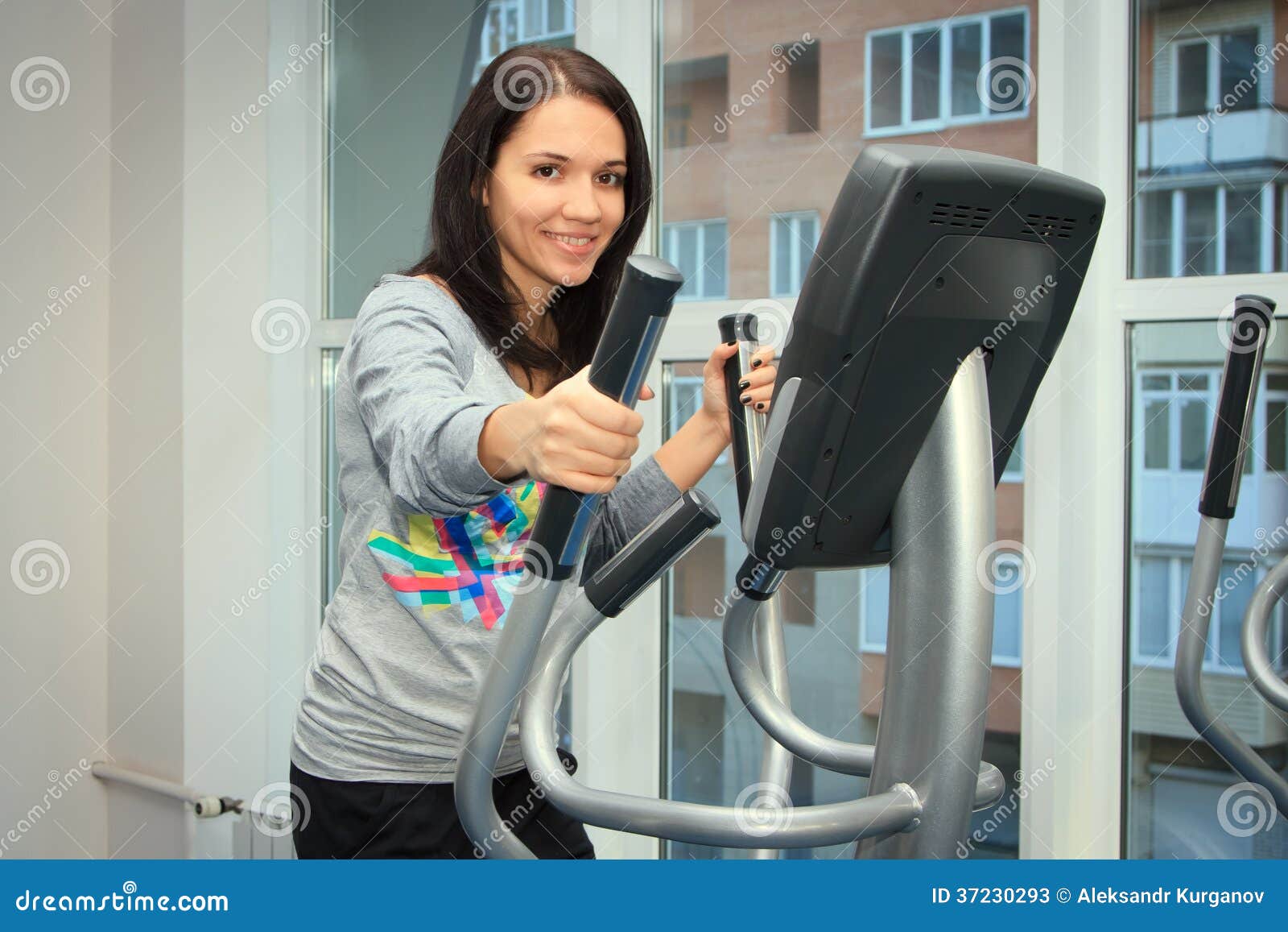 Woman Doing Exercise on a Elliptical Trainer Stock Image - Image of ...