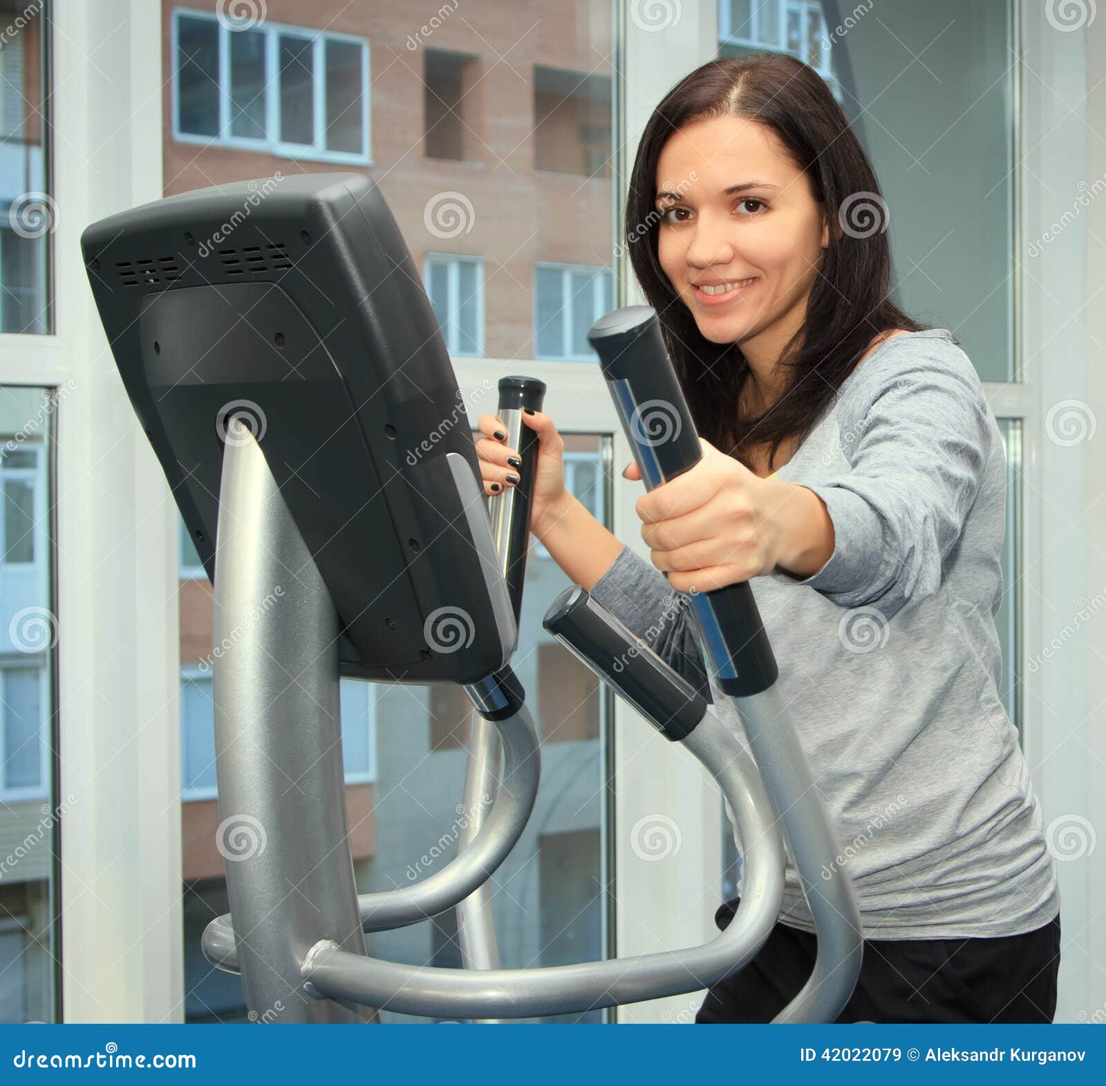 Woman Doing Exercise on a Elliptical Trainer Stock Image - Image of ...