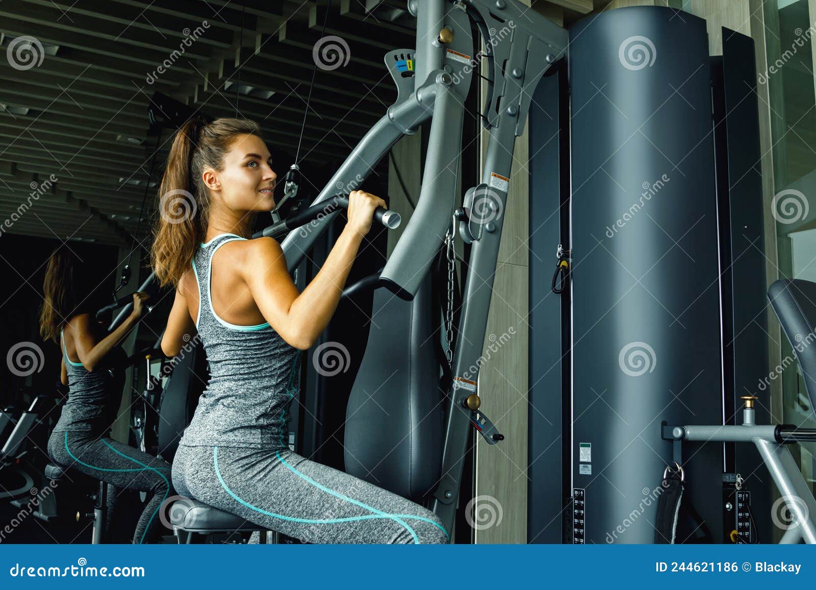 Woman Doing Exercise for Her Back in Gym Stock Photo - Image of ...
