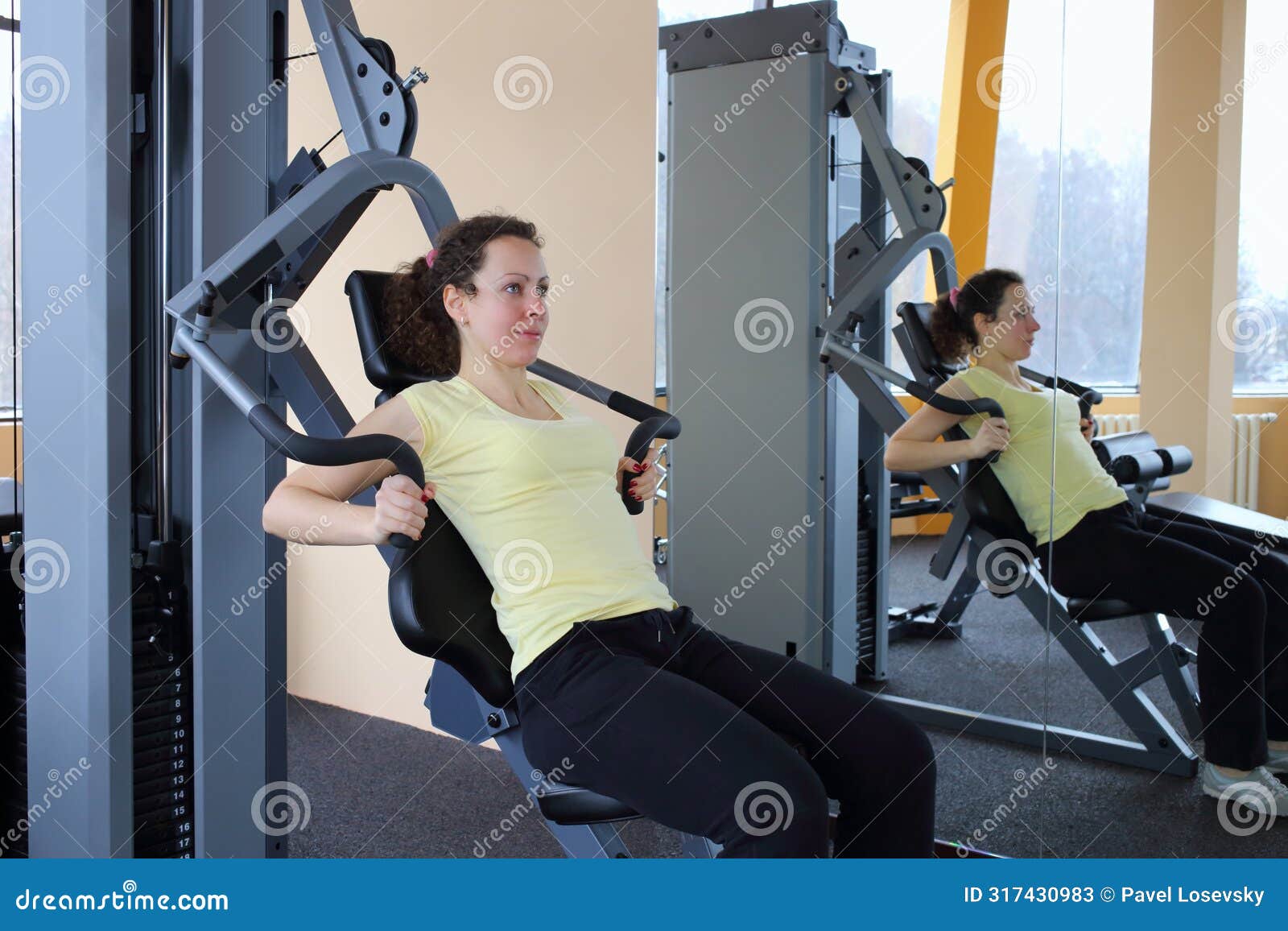 Woman Doing Exercise on a Simulator in the Stock Image - Image of ...