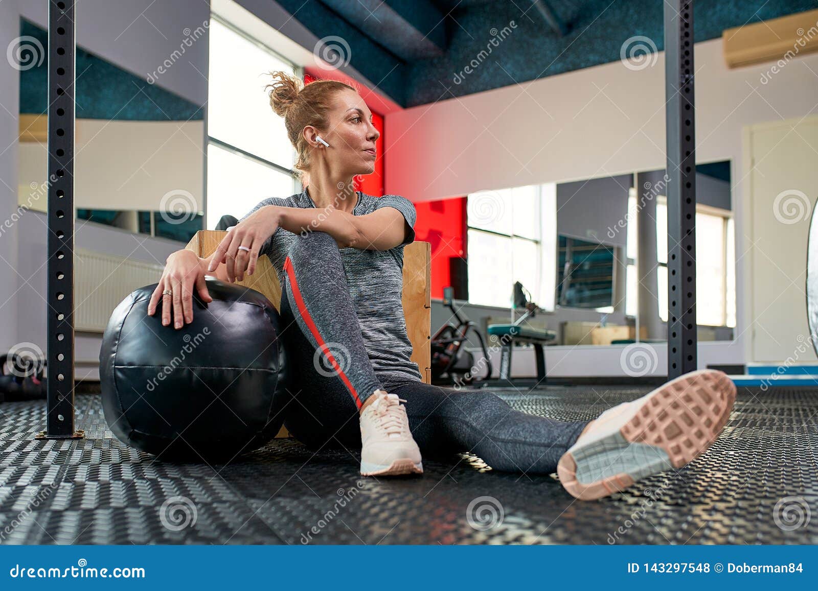 Woman Doing Exercises With Fitball In Fitness Gym Class Engaging Core