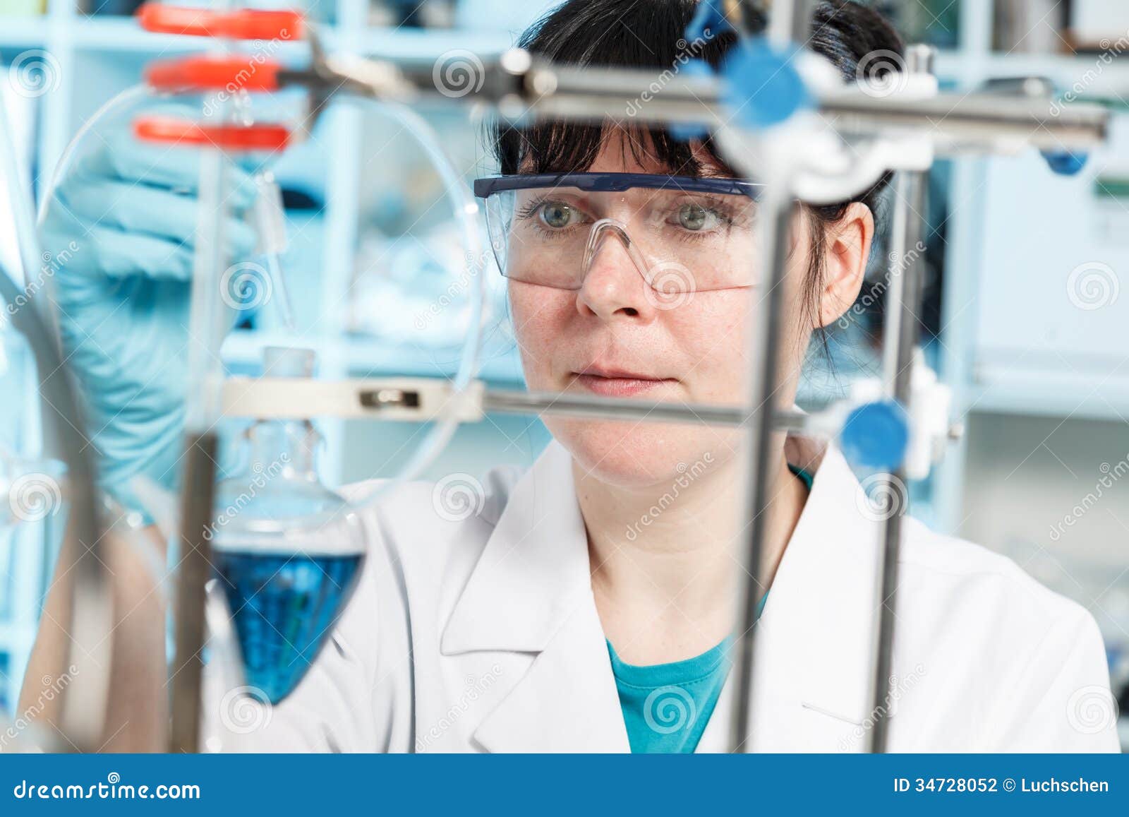 Woman doing experiment stock photo. Image of chemical - 34728052