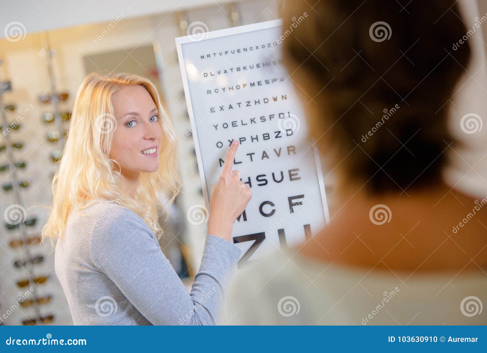 Woman Doing Eye Exam at Optician Stock Photo - Image of equipment, shop ...