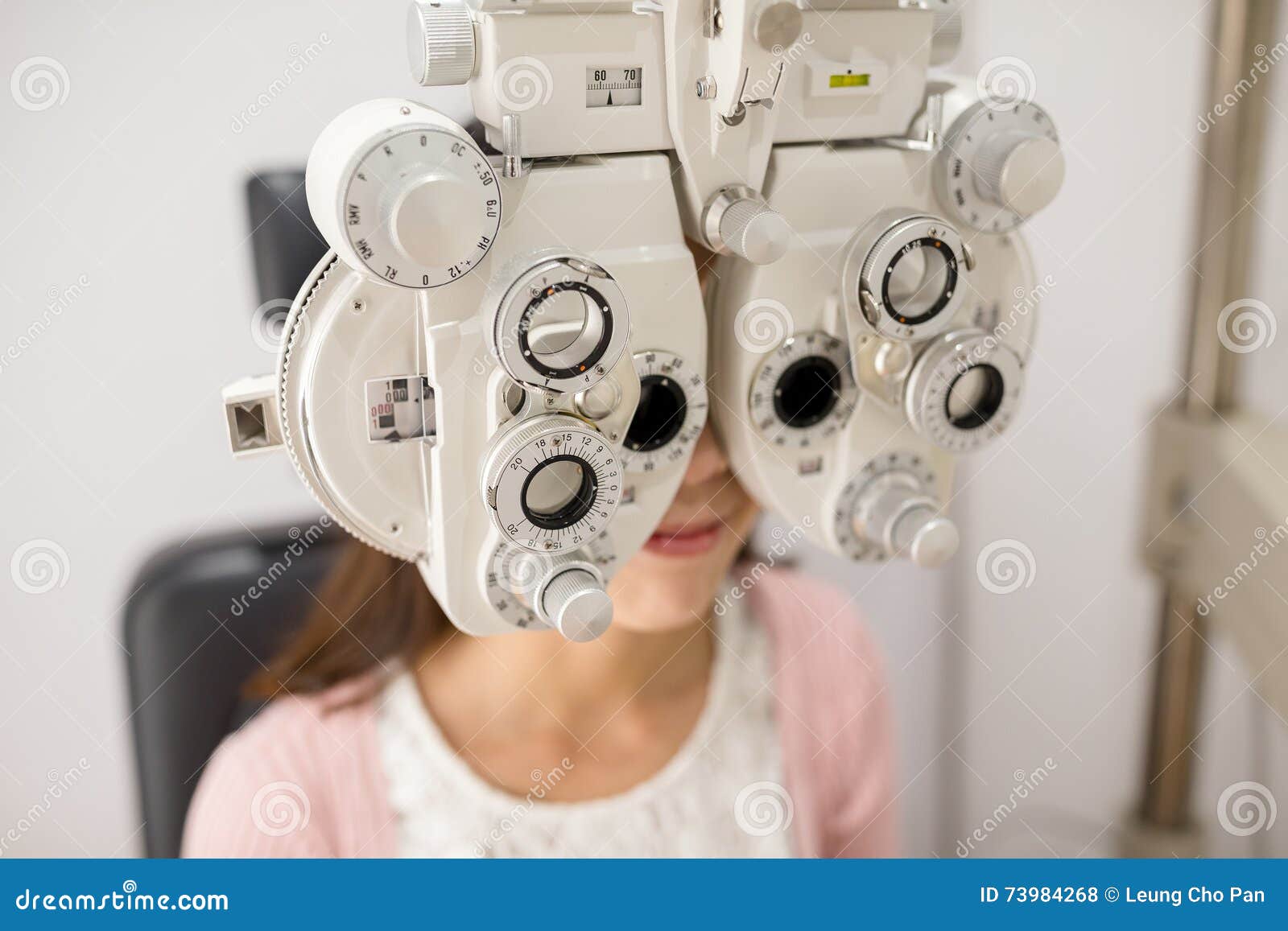 Woman doing eye test stock photo. Image of clinic, girl - 73984268
