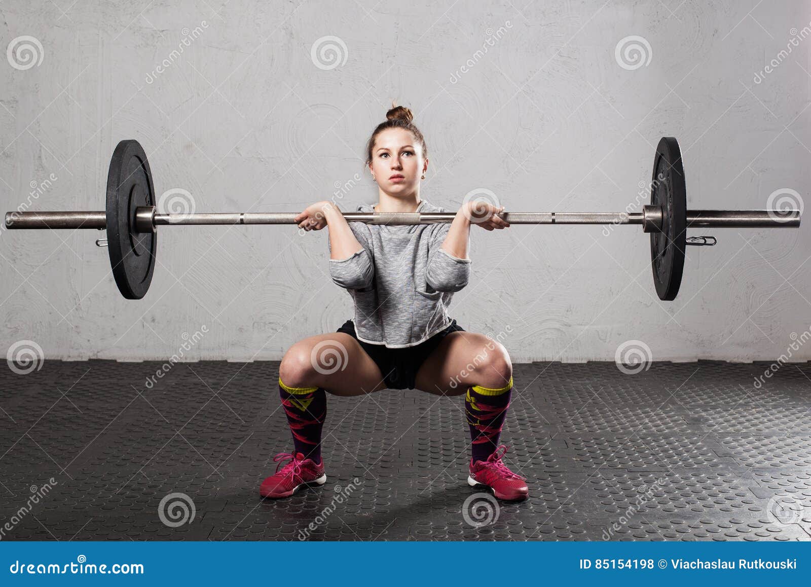 Woman doing a front squat stock photo. Image of training - 85154198