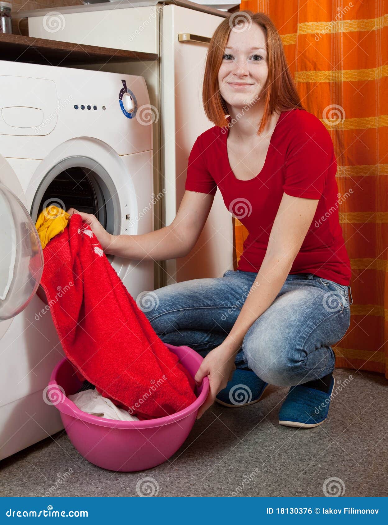 Woman doing laundry stock photo. Image of household, open - 18130376