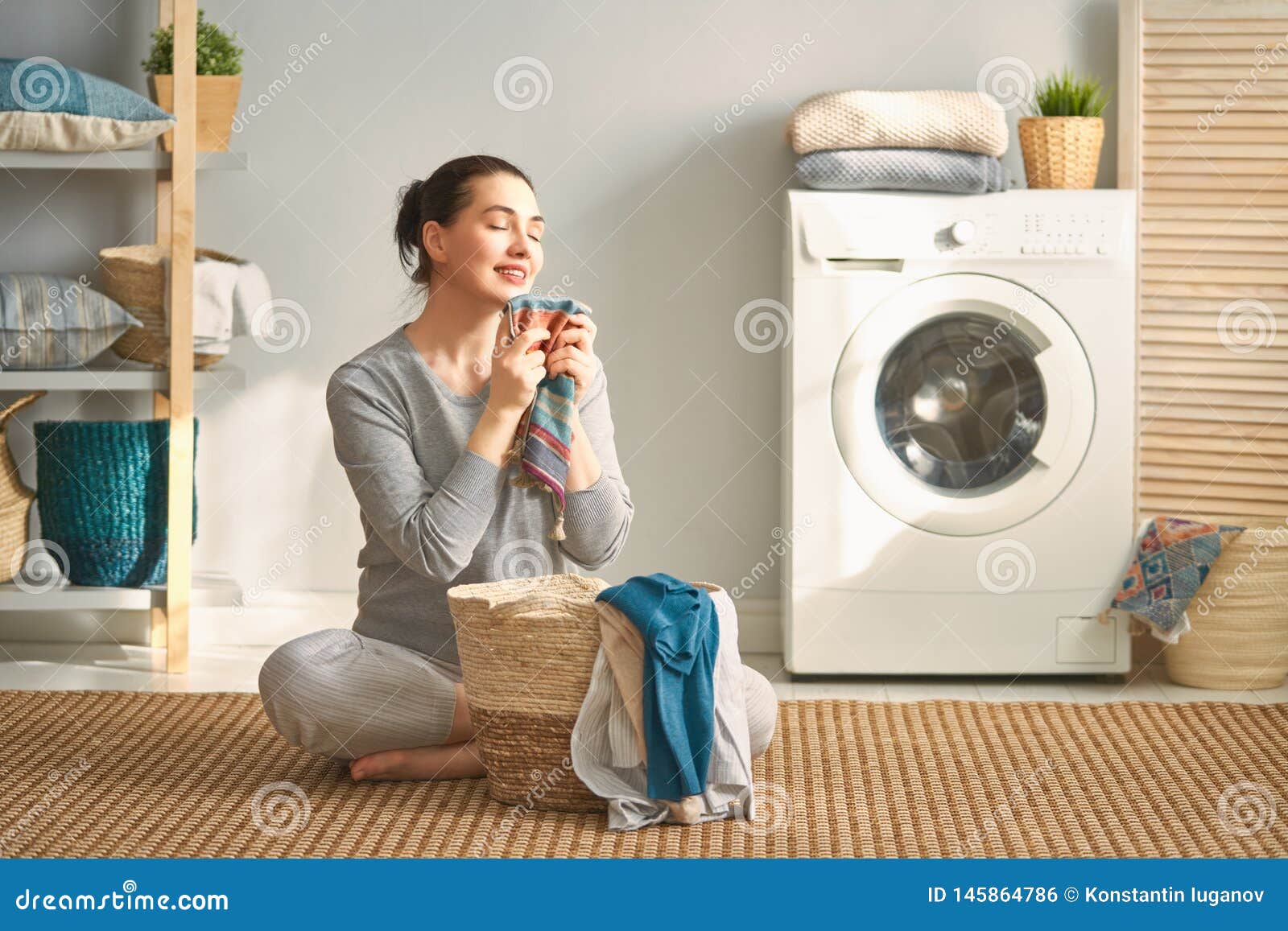 Woman is doing laundry stock photo. Image of home, laundry - 145864786