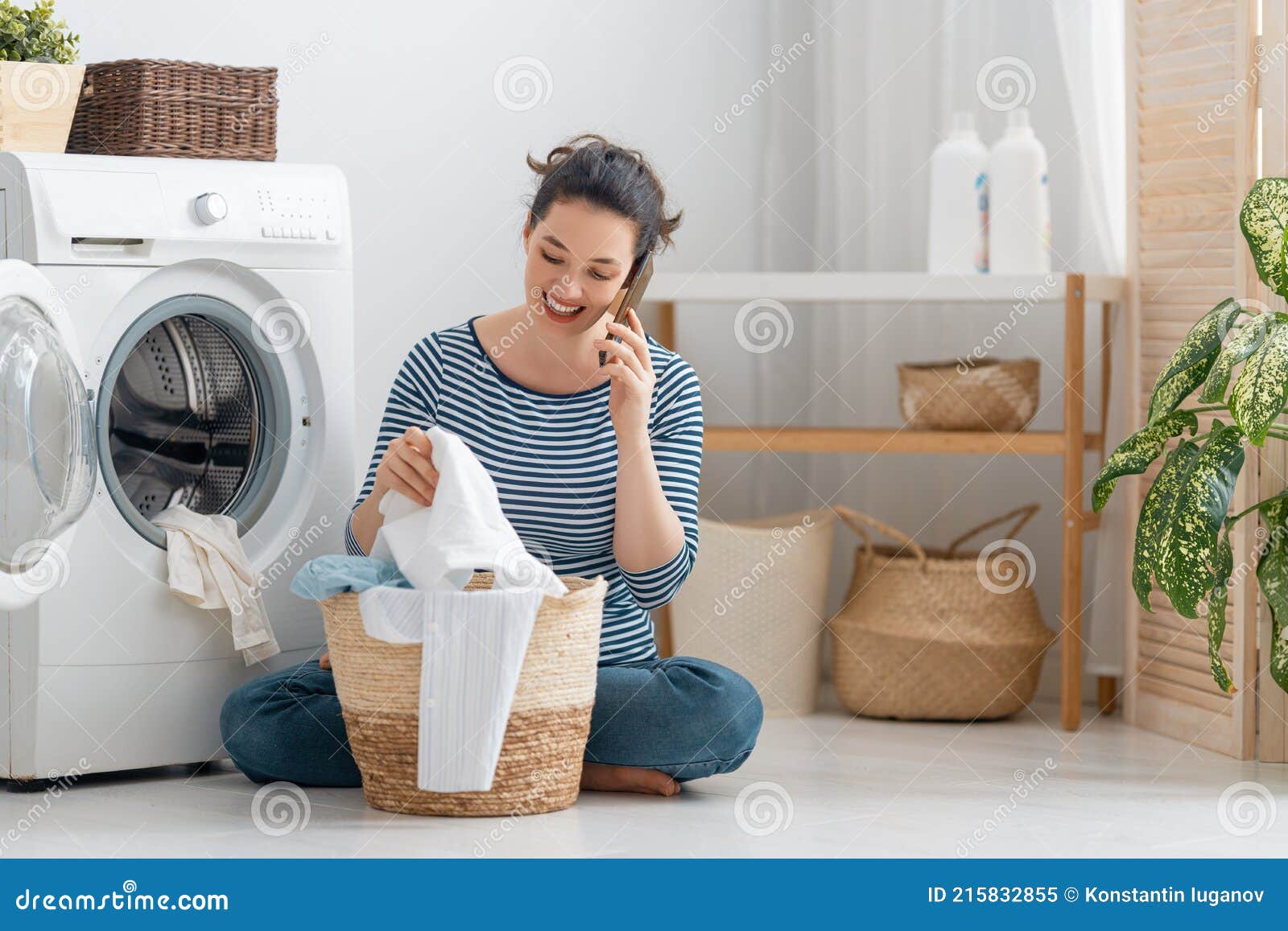 Woman is doing laundry stock image. Image of housecleaning - 215832855