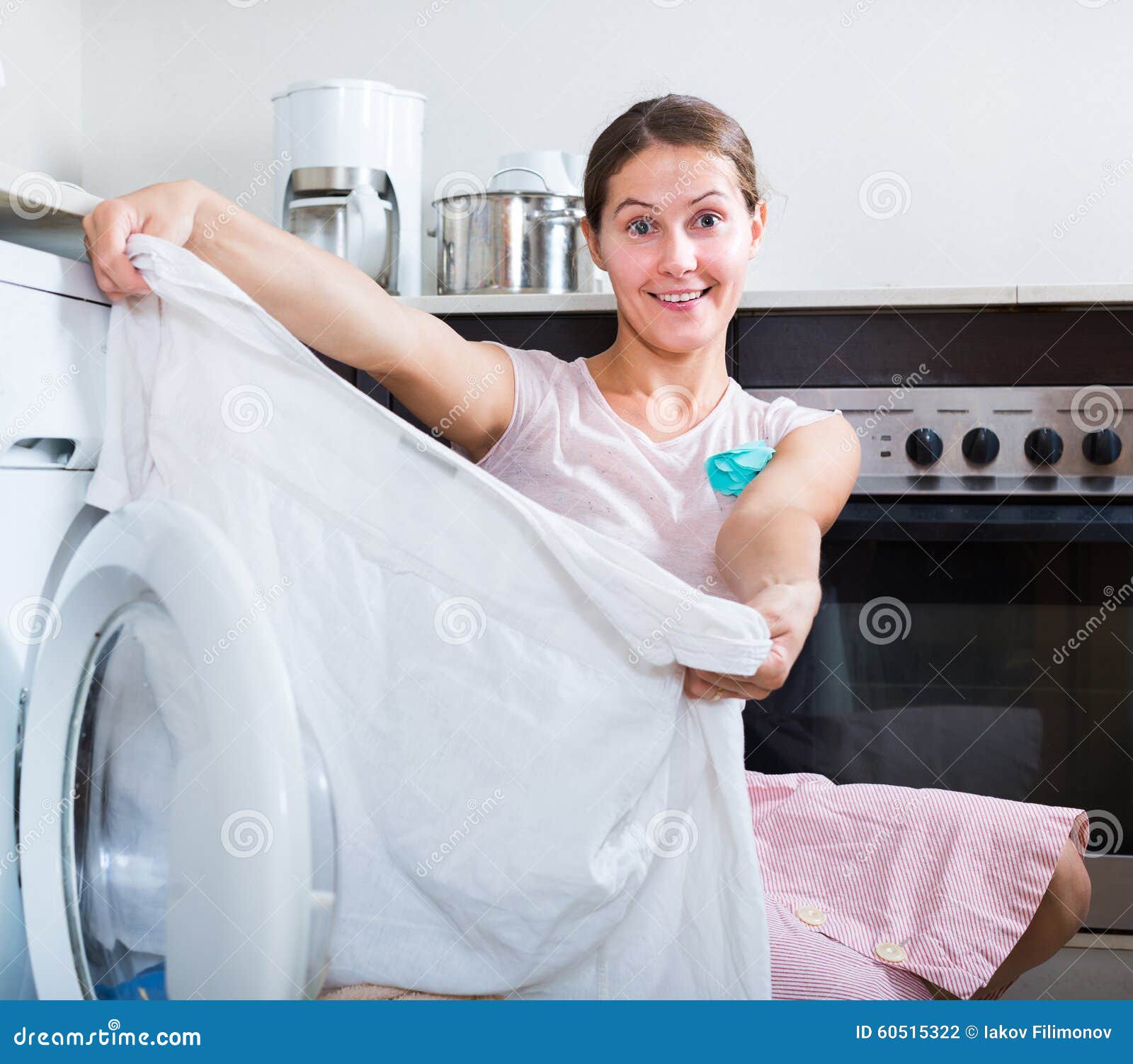 Woman doing laundry stock photo. Image of smiling, european - 60515322