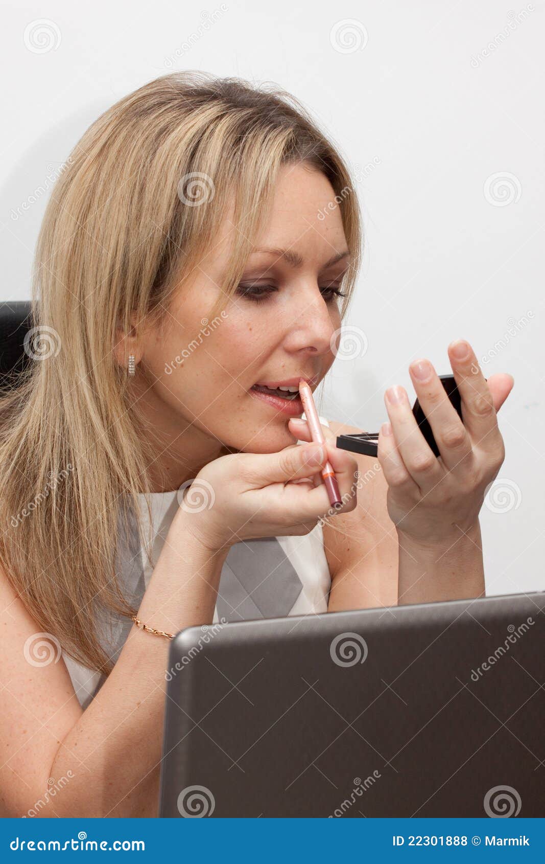 Woman Doing Make-up at Work Stock Photo - Image of lipstick, lady: 22301888