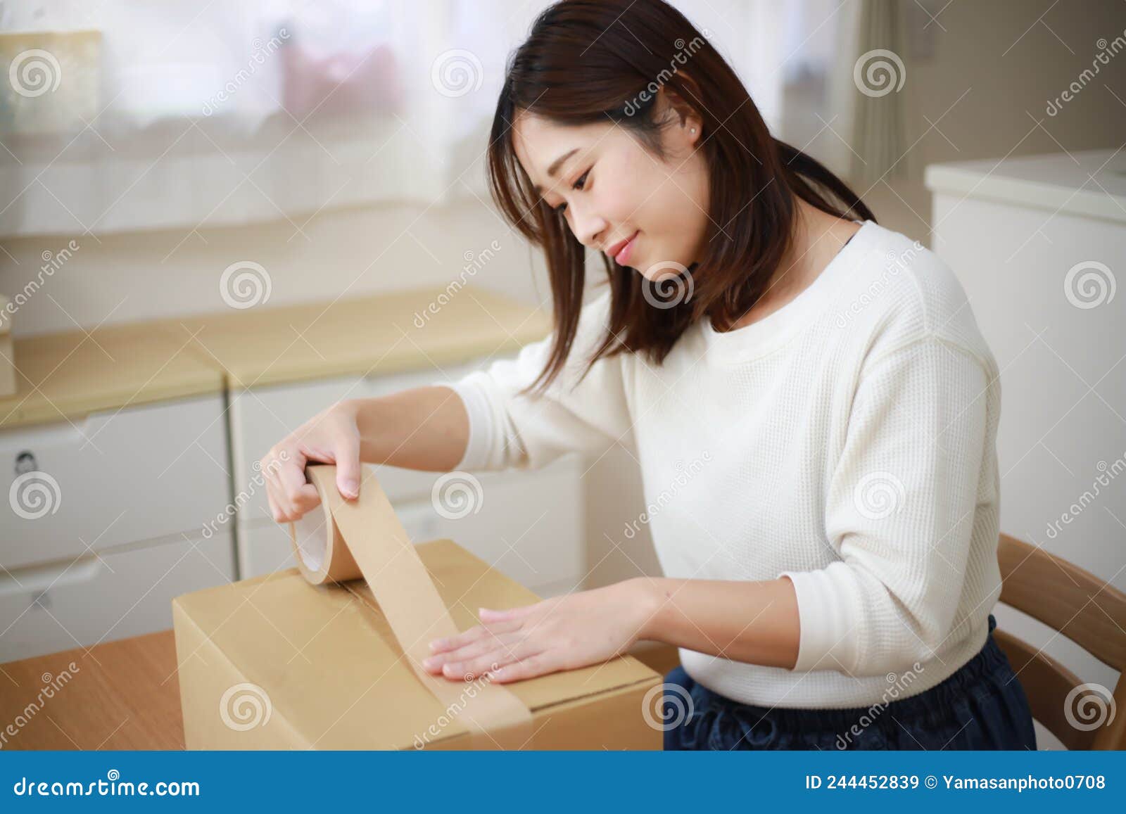 Woman doing packing work stock image. Image of detached - 244452839