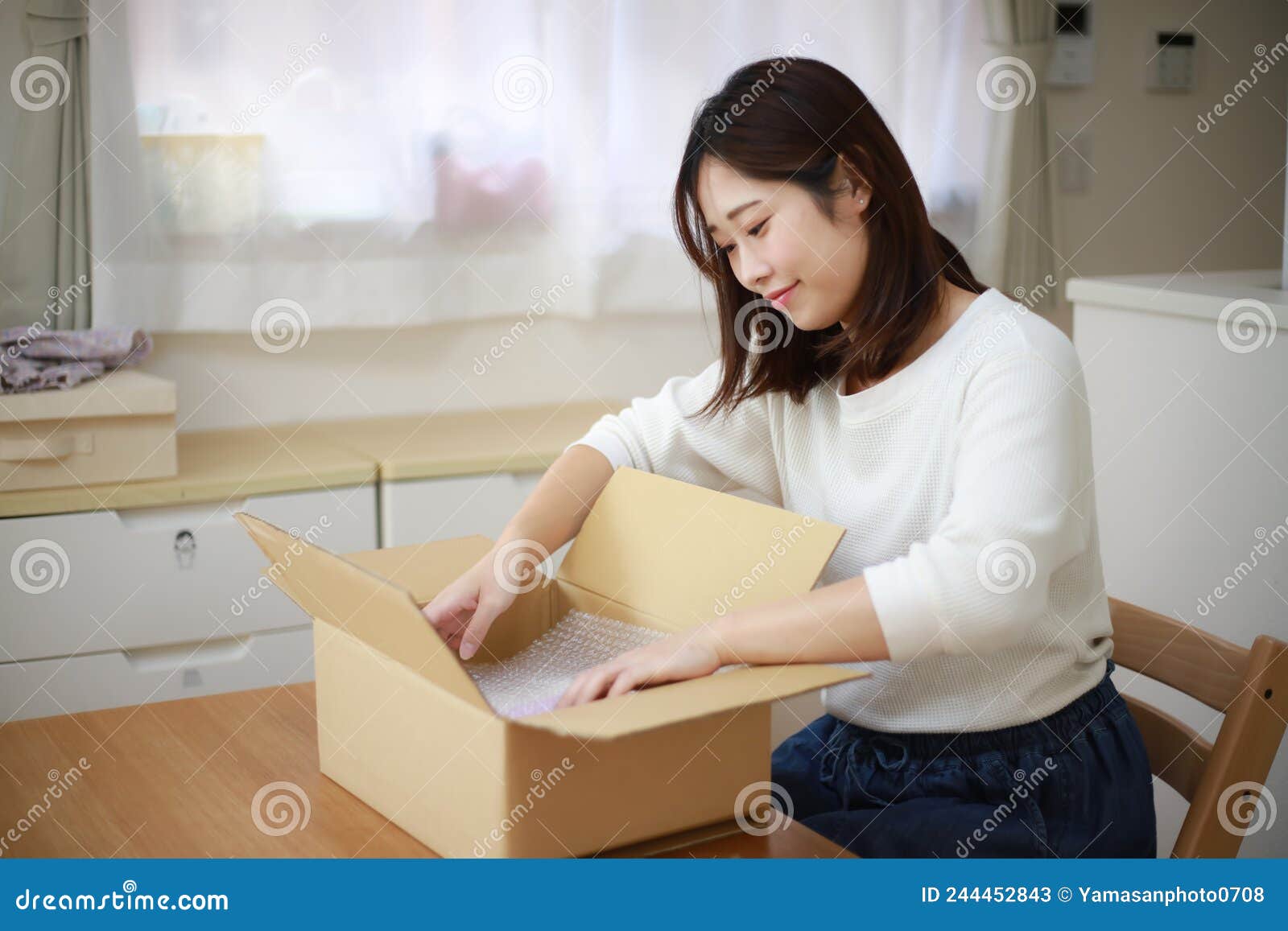 Woman doing packing work stock image. Image of auction - 244452843