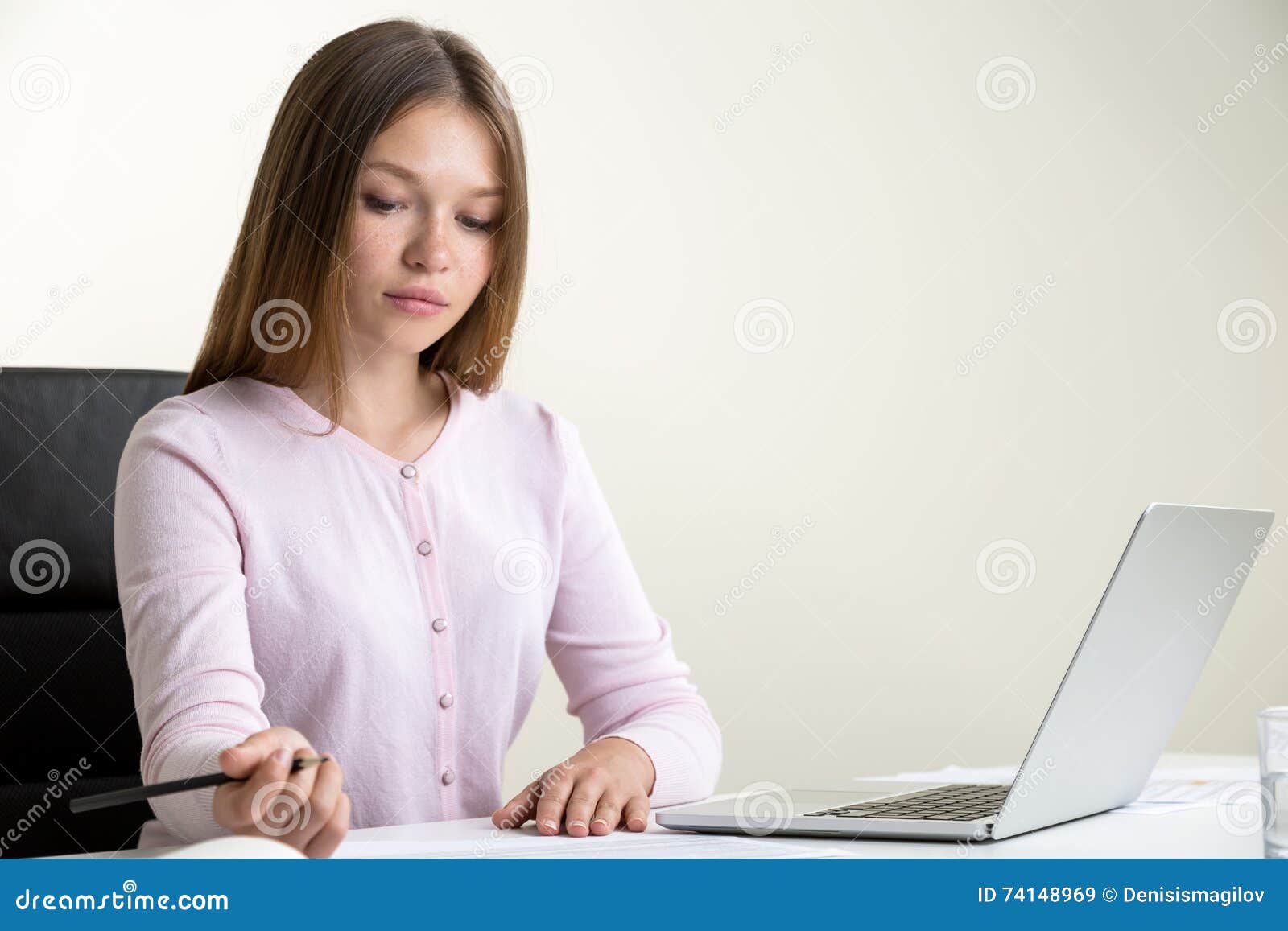 Woman Doing Paperwork Using Laptop Stock Image - Image of female, adult ...