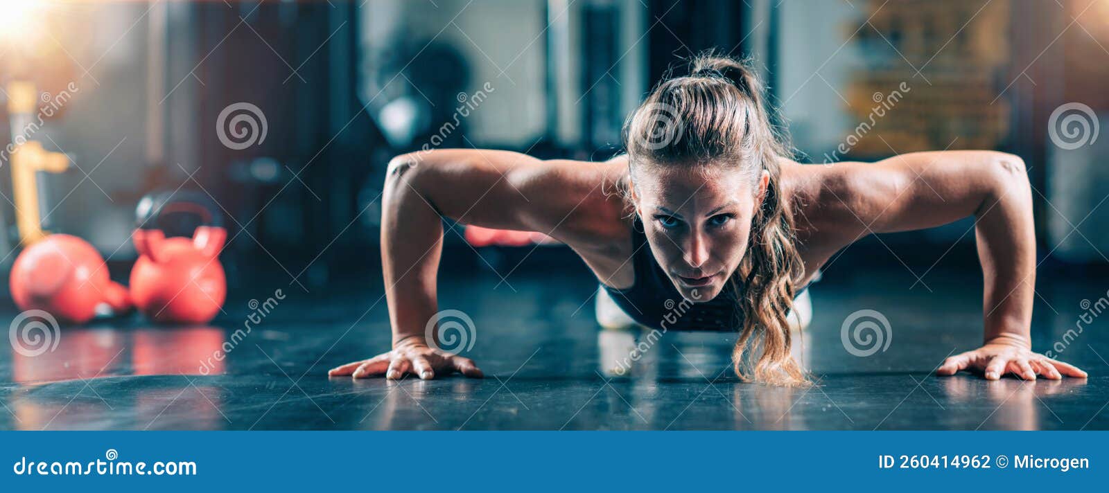Woman Doing Push-ups in the Gym. Strength Training Stock Photo - Image ...