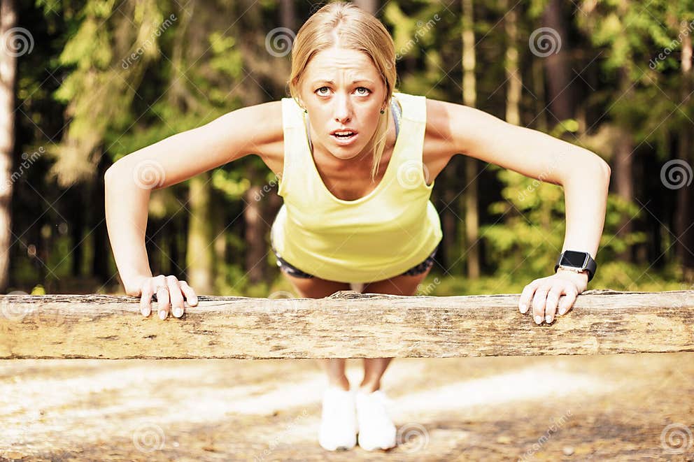 Woman doing pushups stock photo. Image of body, fitness - 60761526