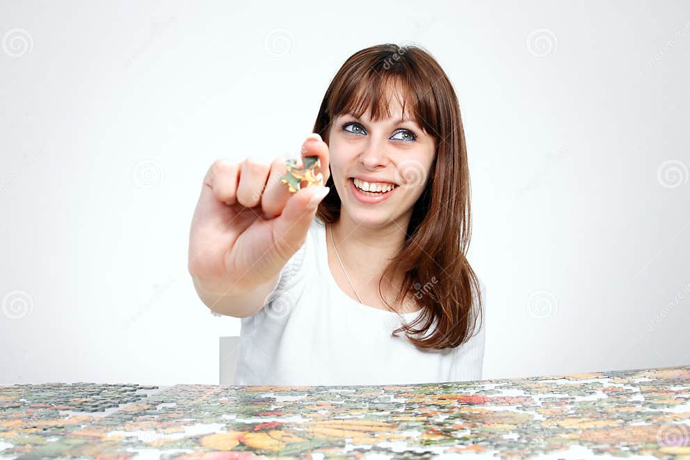 Woman doing puzzle stock photo. Image of photograph, young - 9725346