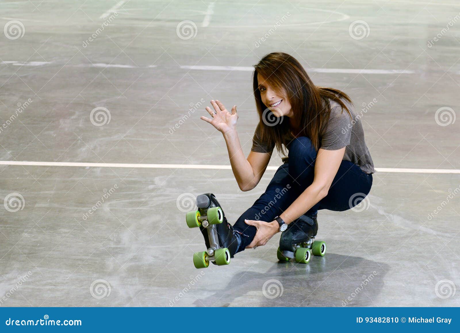 Woman Doing Shoot the Duck Move on Quad Roller Skates Stock Photo ...