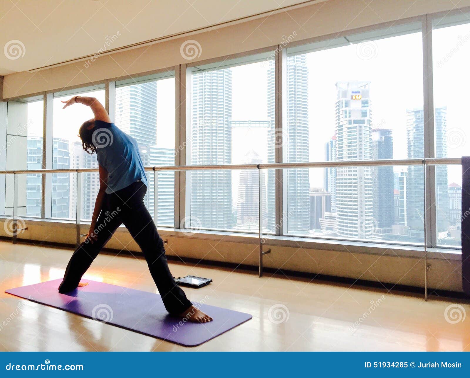 Woman Doing Side Triangle Pose in Yoga Studio Stock Image - Image of ...
