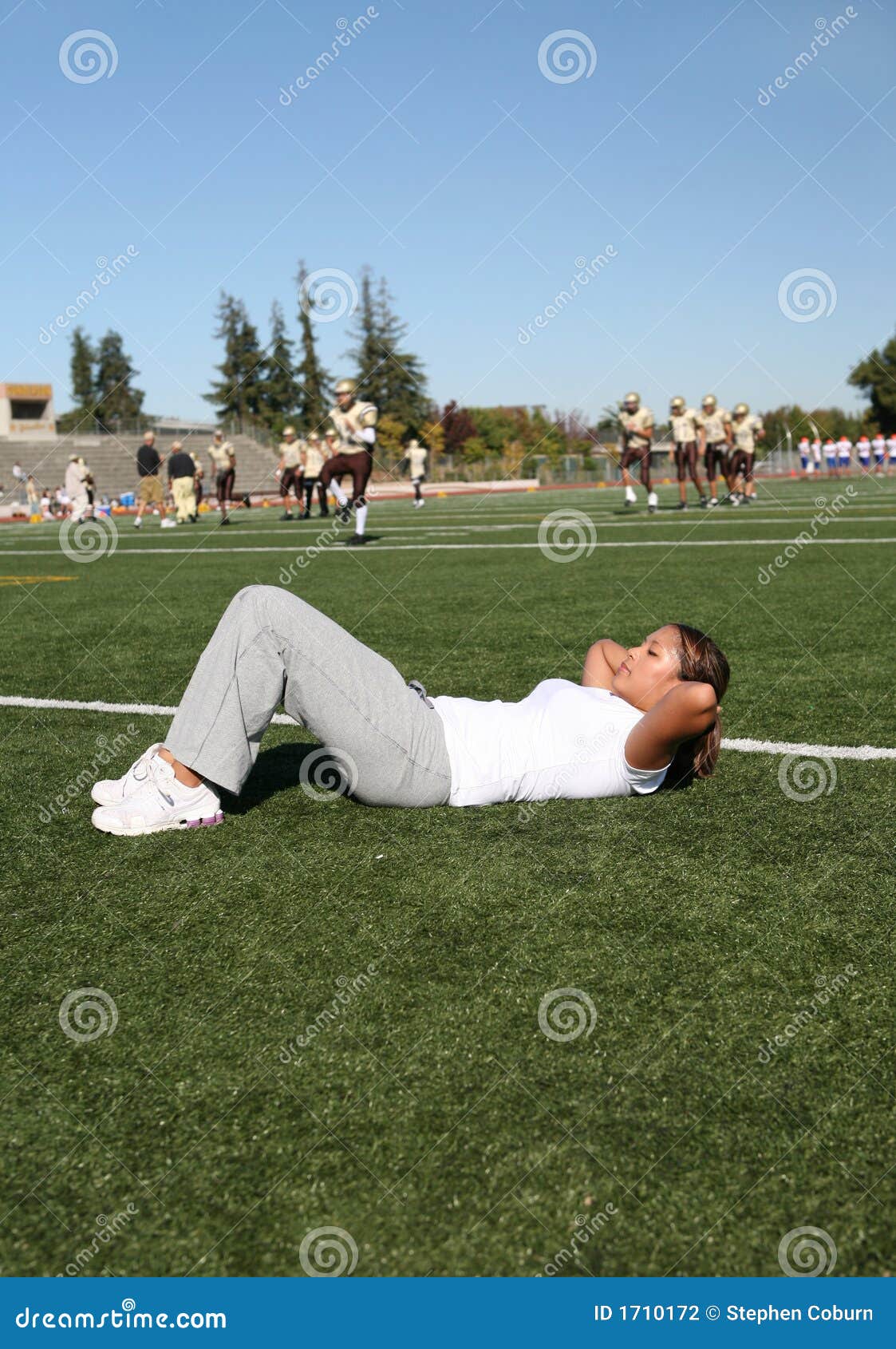 Woman Doing Sit-Ups stock photo. Image of tired, sweaty - 1710172