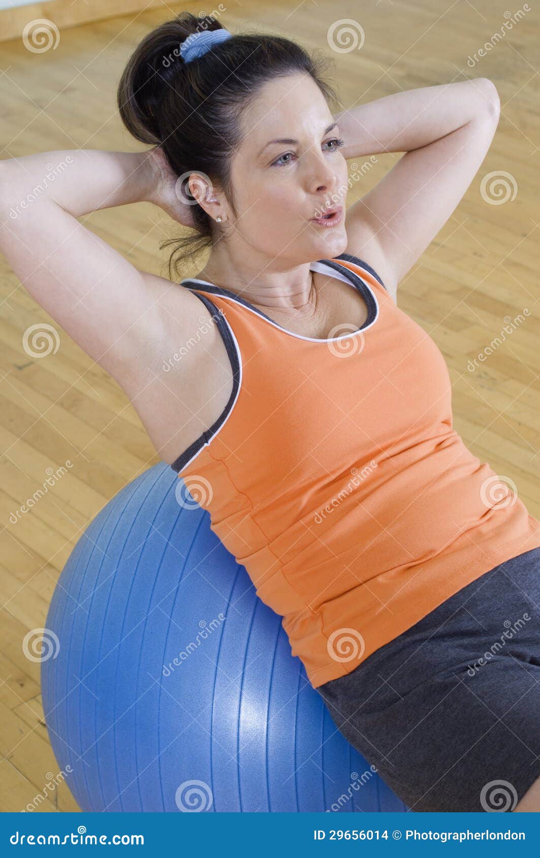 Woman Doing Sit-Ups stock photo. Image of exercise, indoors - 29656014