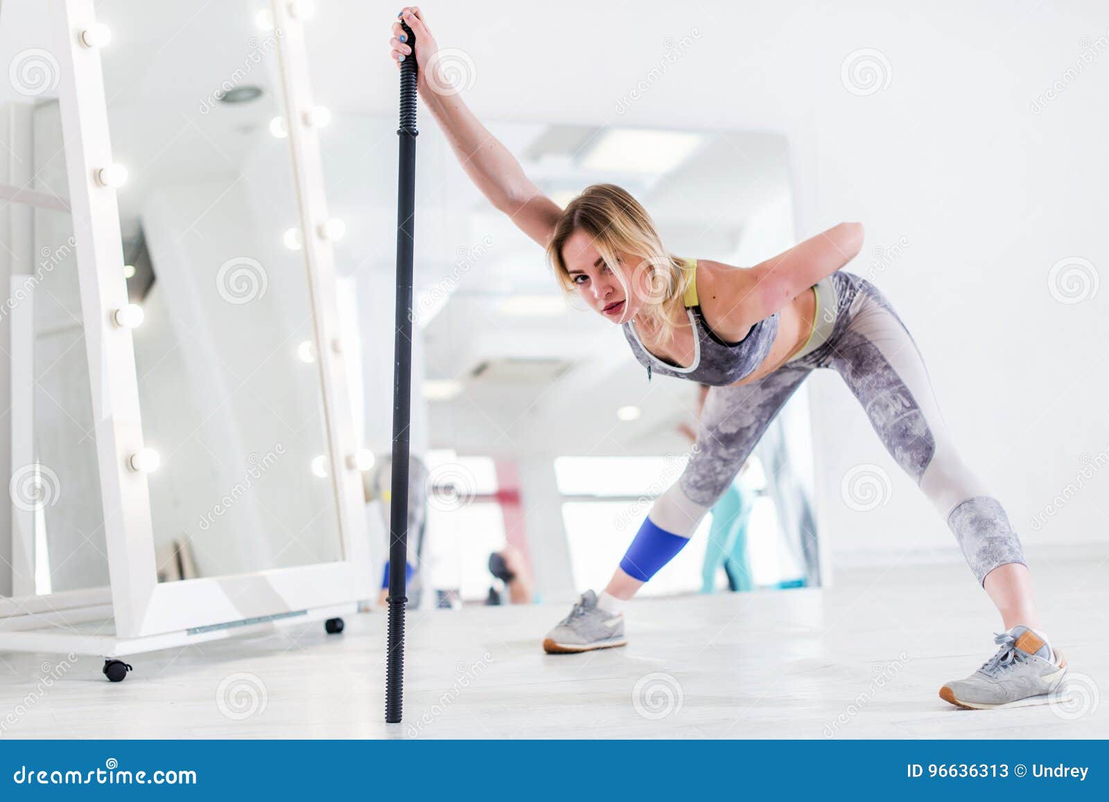 Woman Doing Stretching Exercise for Hamstrings and Back Leaning Forward ...