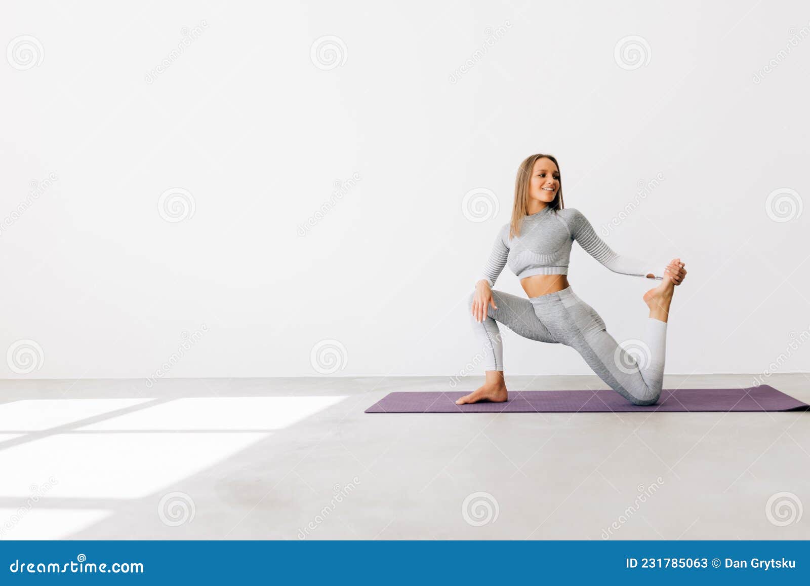 Young Woman Doing Stretching Exercises in a Gym Stock Image - Image of ...