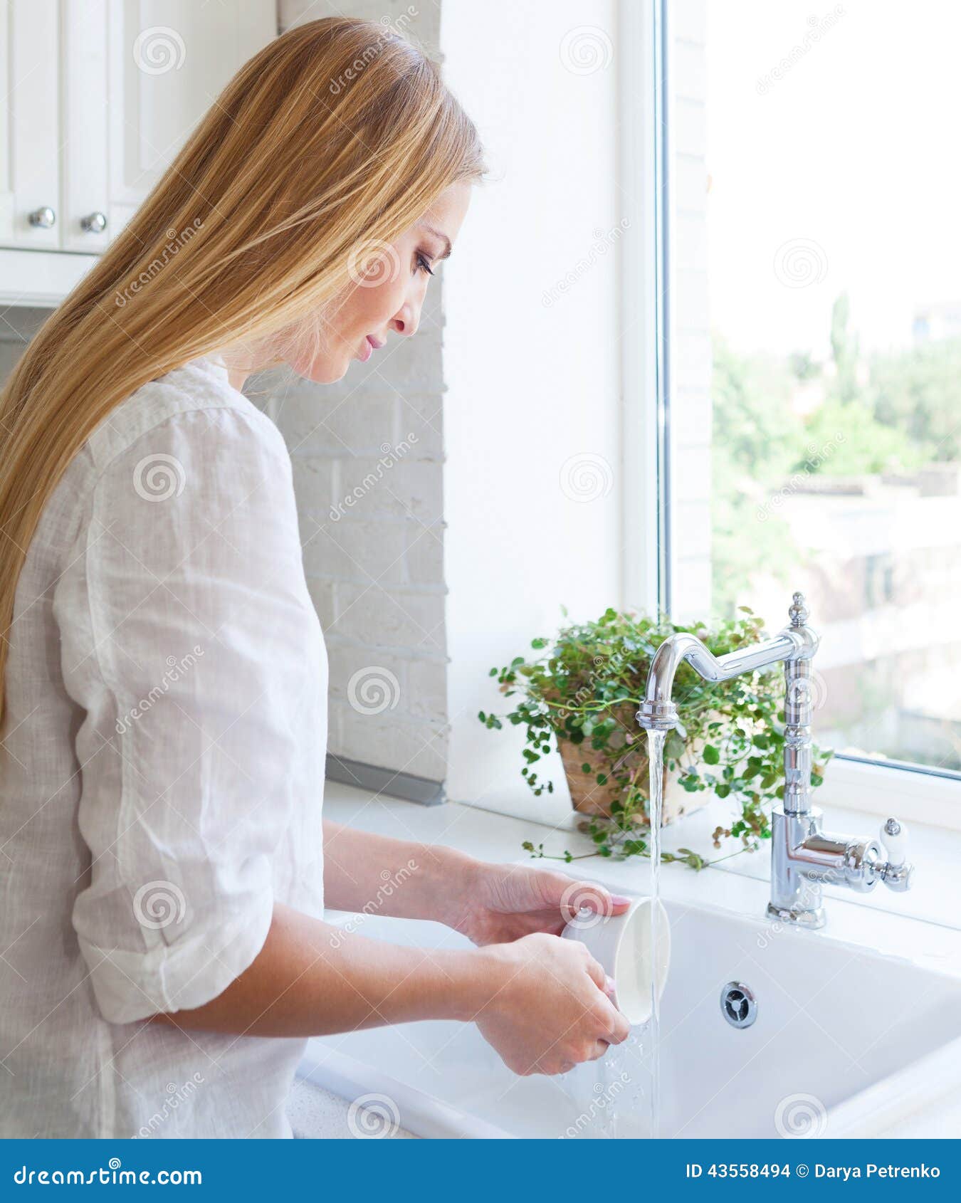 Woman doing the washing up stock photo. Image of female - 43558494