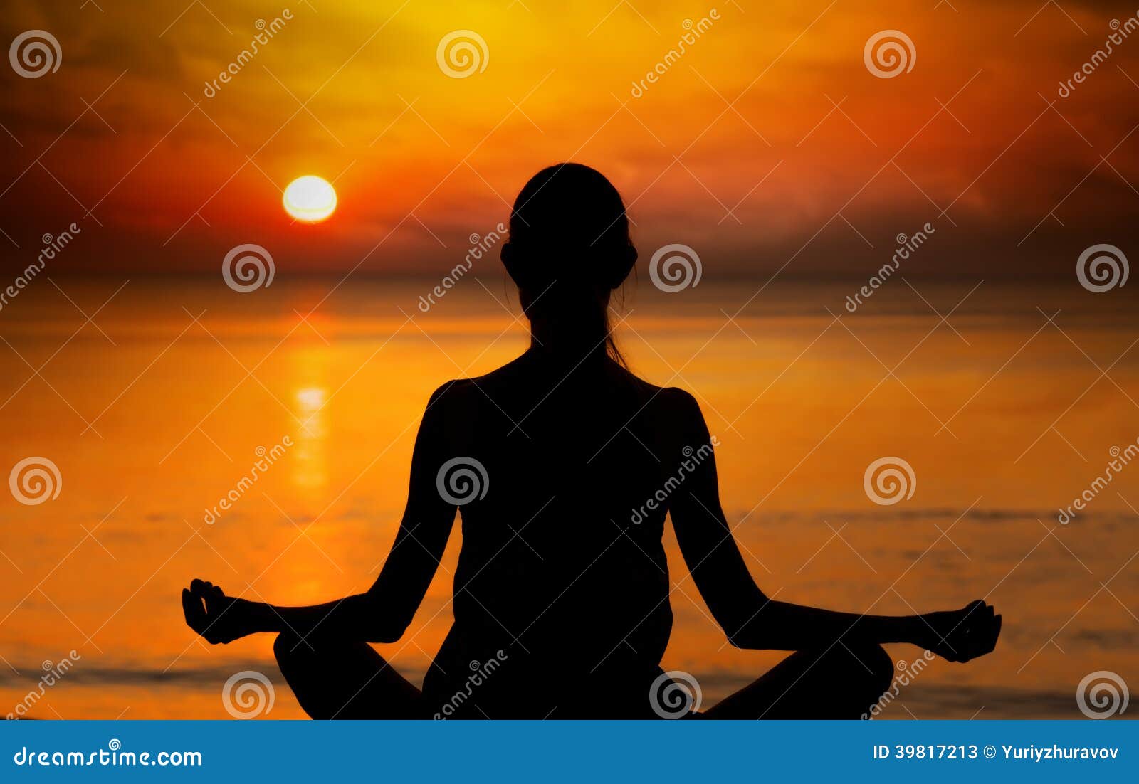 Woman doing Yoga at sunset stock image. Image of meditating - 39817213