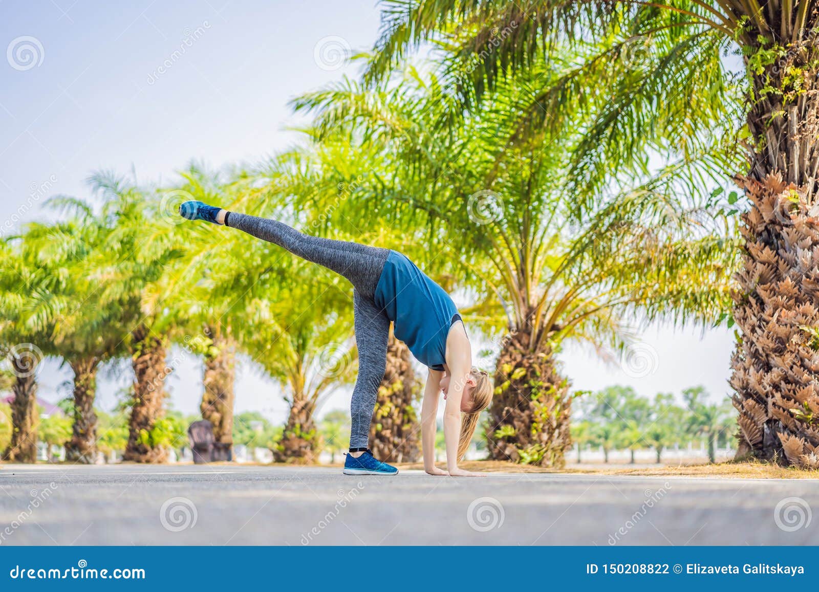 Woman Doing Yoga in a Tropical Park Stock Photo - Image of flexibility ...