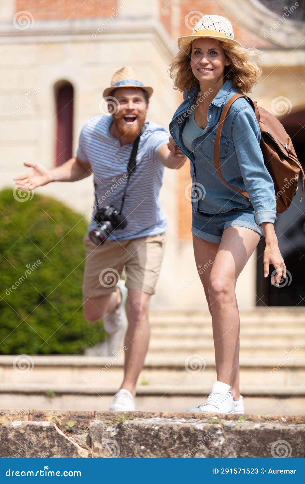 Woman Dragging Man Down Steps while on Holiday Stock Image - Image of ...