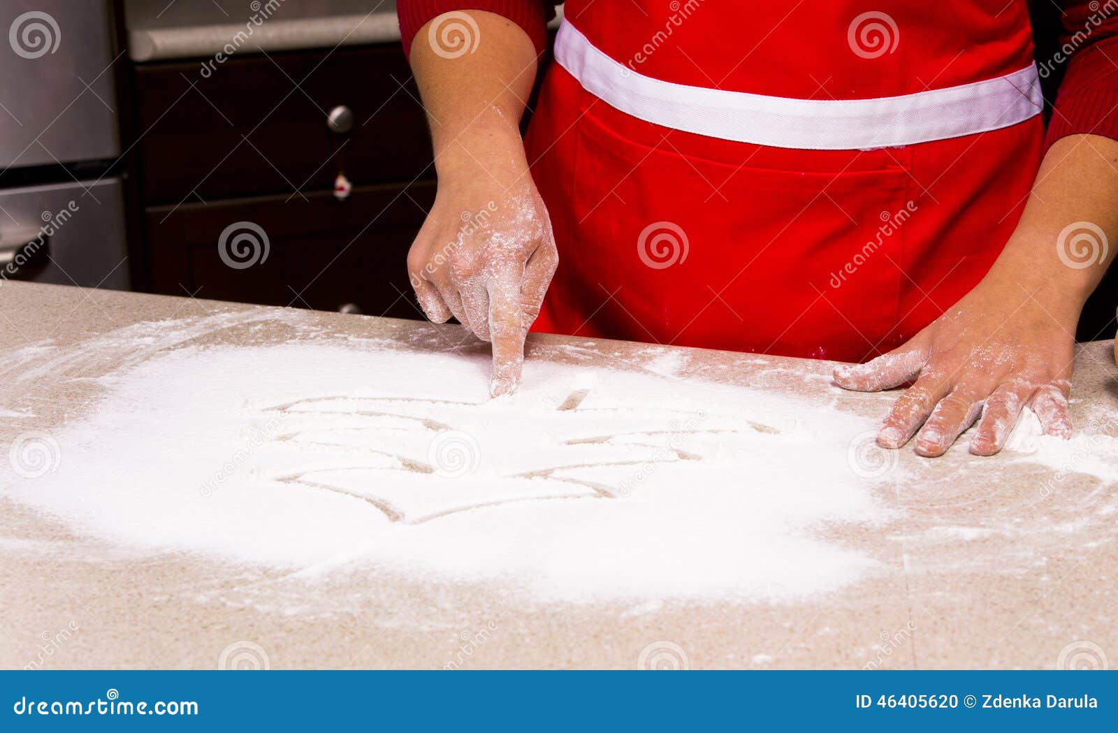 Woman drawing into flour stock photo. Image of white - 46405620