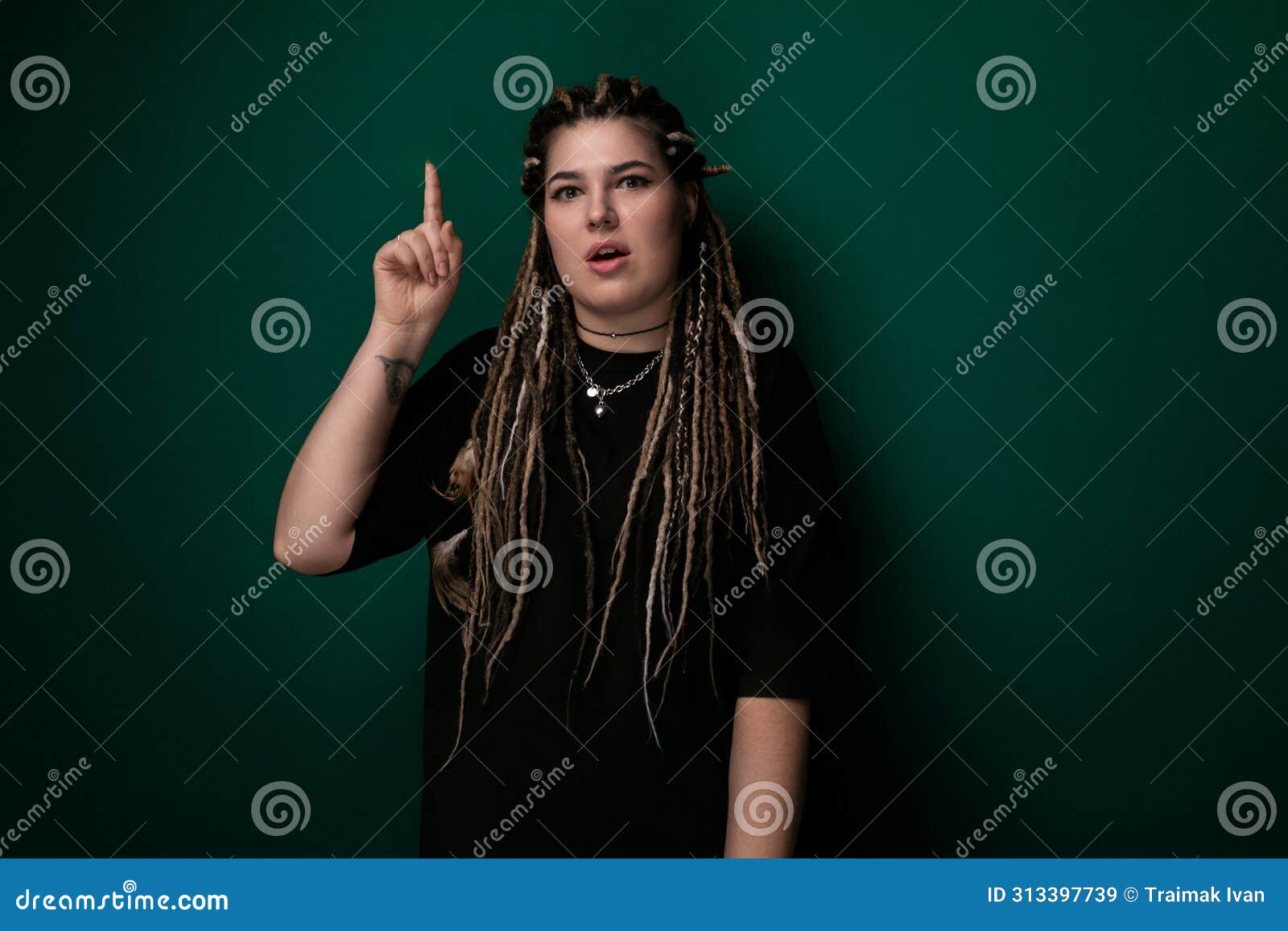 Woman with Dreadlocks Pointing at Something Stock Image - Image of ...