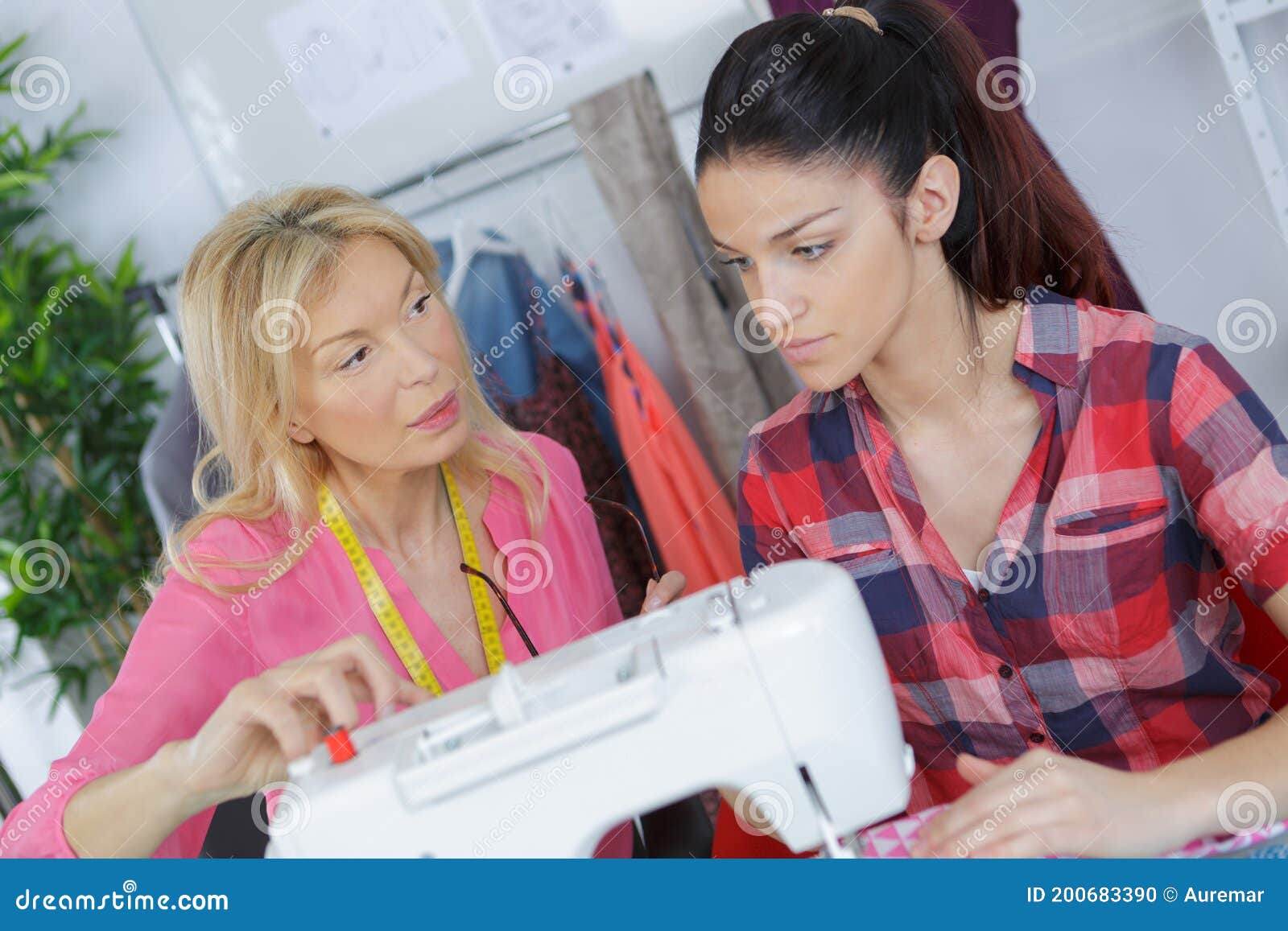 Woman in Dressmaking Class Helping Student Stock Photo - Image of ...