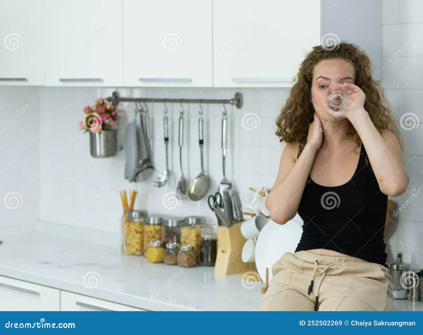 Woman Drink Water Sitting In Kitchen With Copy Space Beautiful