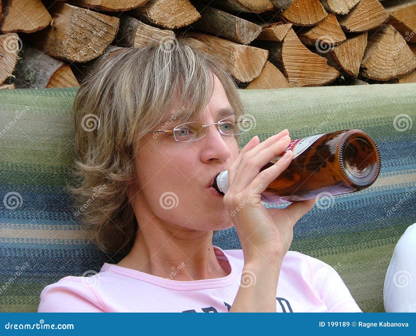 Woman drinking beer stock image. Image of refreshing, alcoholic - 199189
