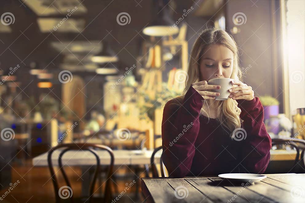 Woman drinking in a cafe stock image. Image of drinking - 89652077