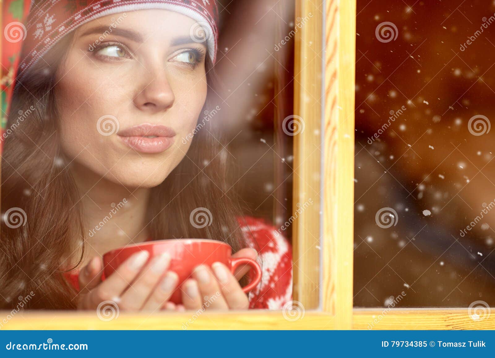 Woman Drinking Coffee and Looking Out of the Window on Winter Da Stock ...