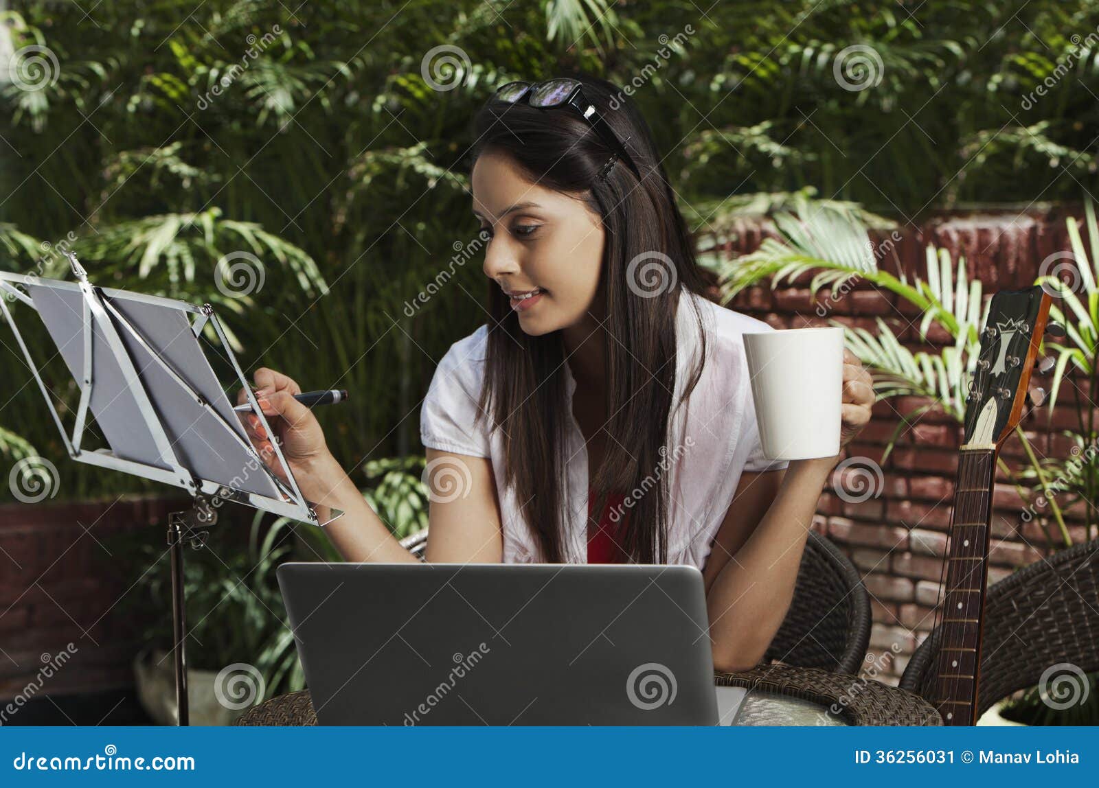 Woman Drinking Coffee and Using a Laptop Stock Image - Image of sitting ...