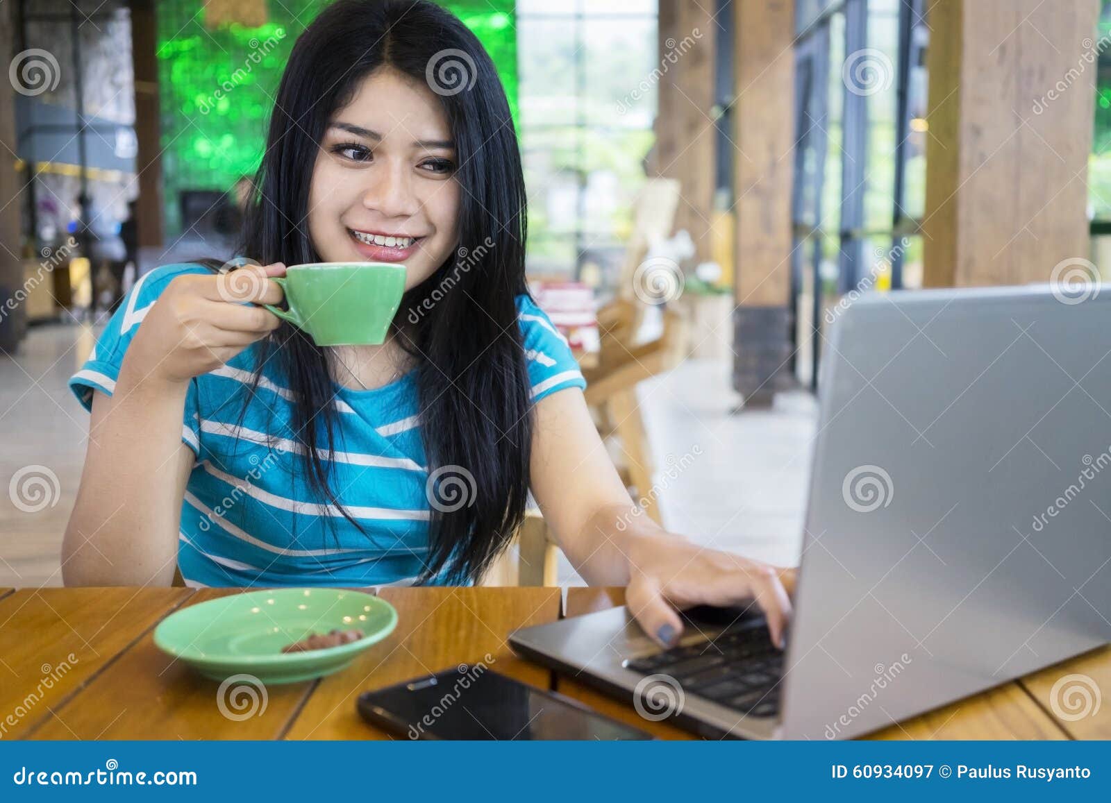 Woman Drinking Coffee while Using Laptop Stock Image - Image of ...
